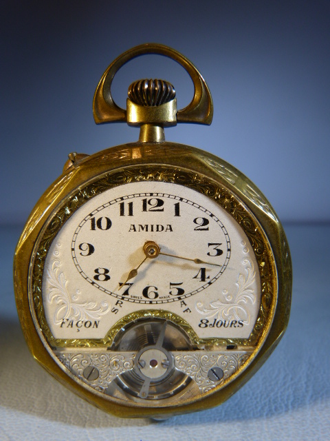 Amida Facon 8 day open faced Brass pocket watch, the silvered dial with ...