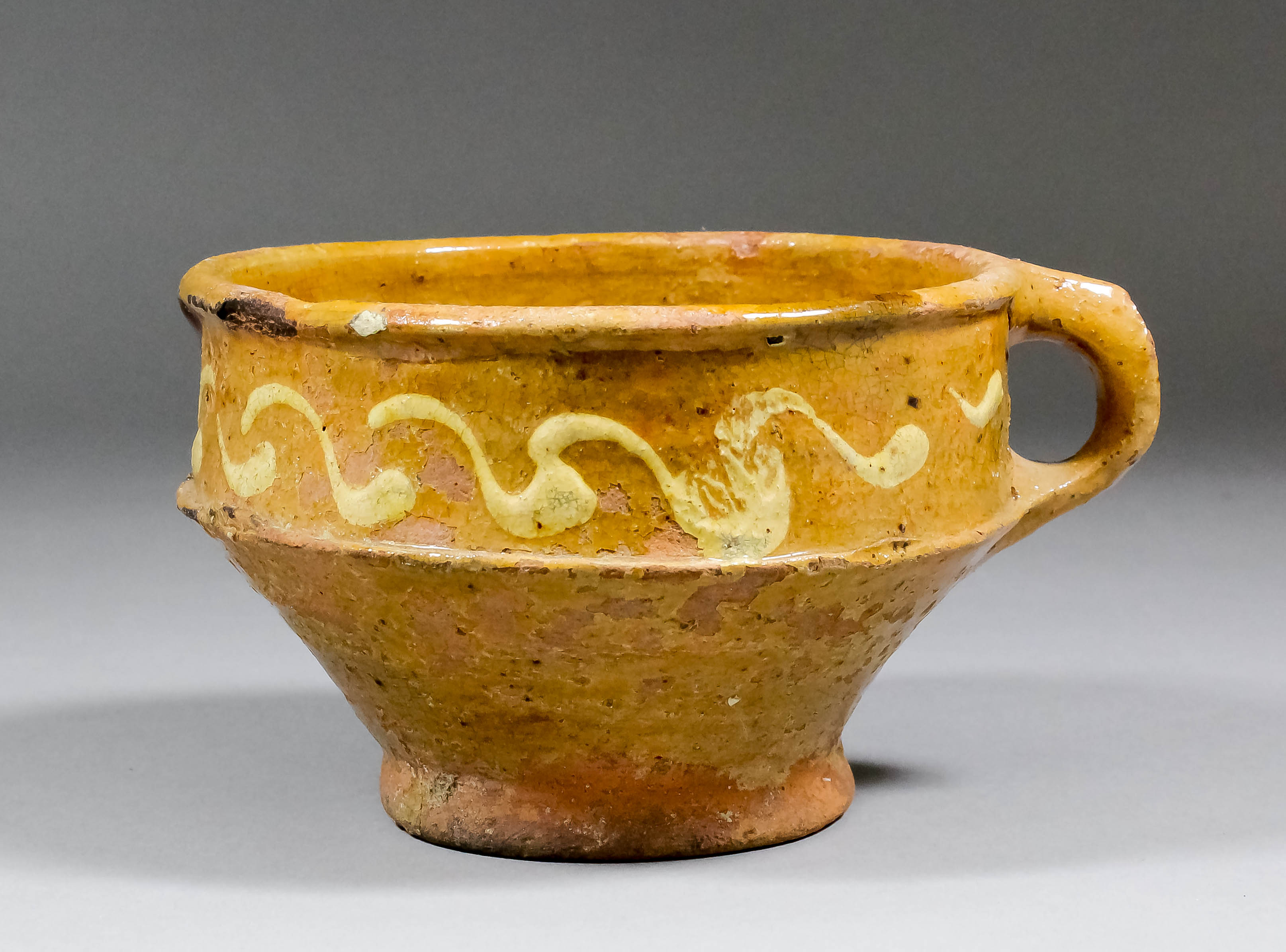 A Dutch single handled slipware pottery bowl, 17th Century, 5.5ins ...