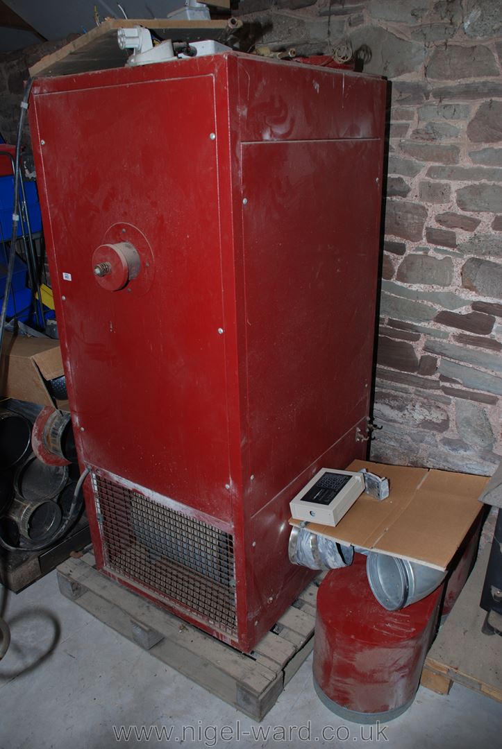 A single phase, oil-fired "Combat" Space Heater and a control panel.