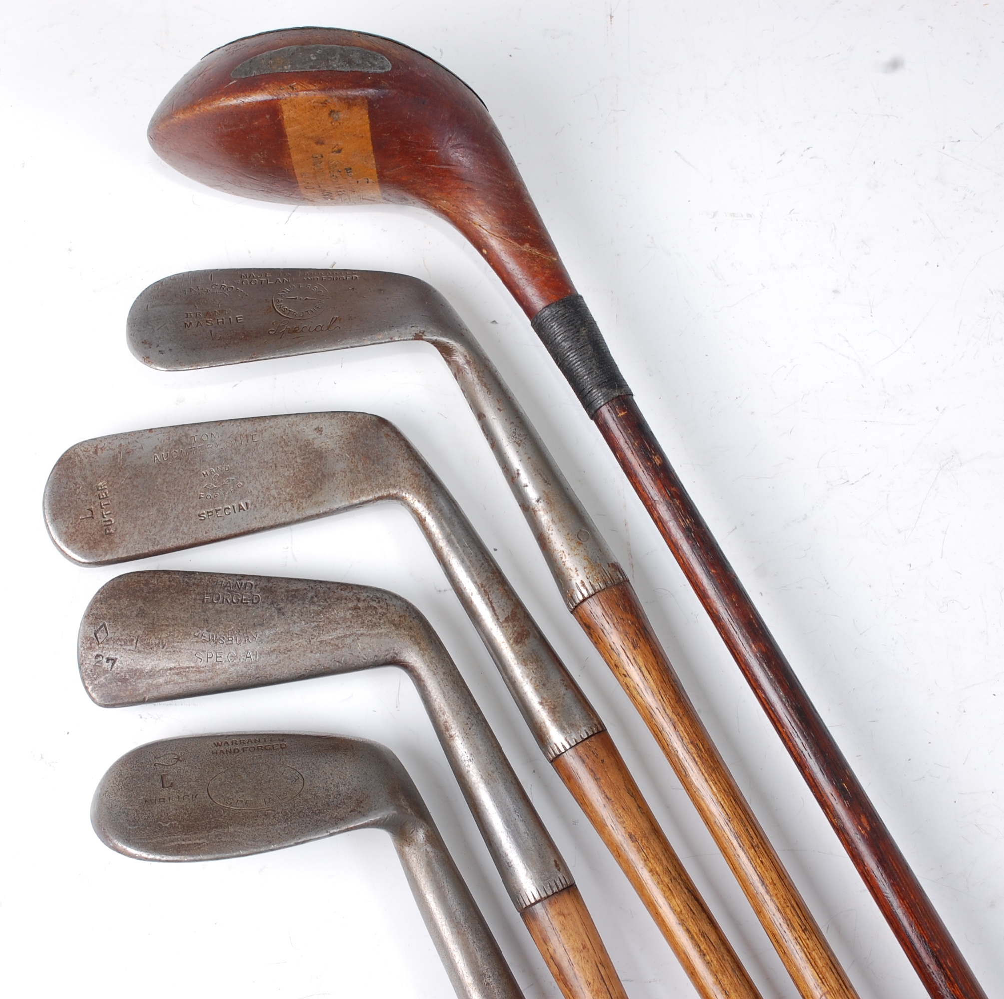 A collection of five 1920's golf clubs, each with its original hickory ...