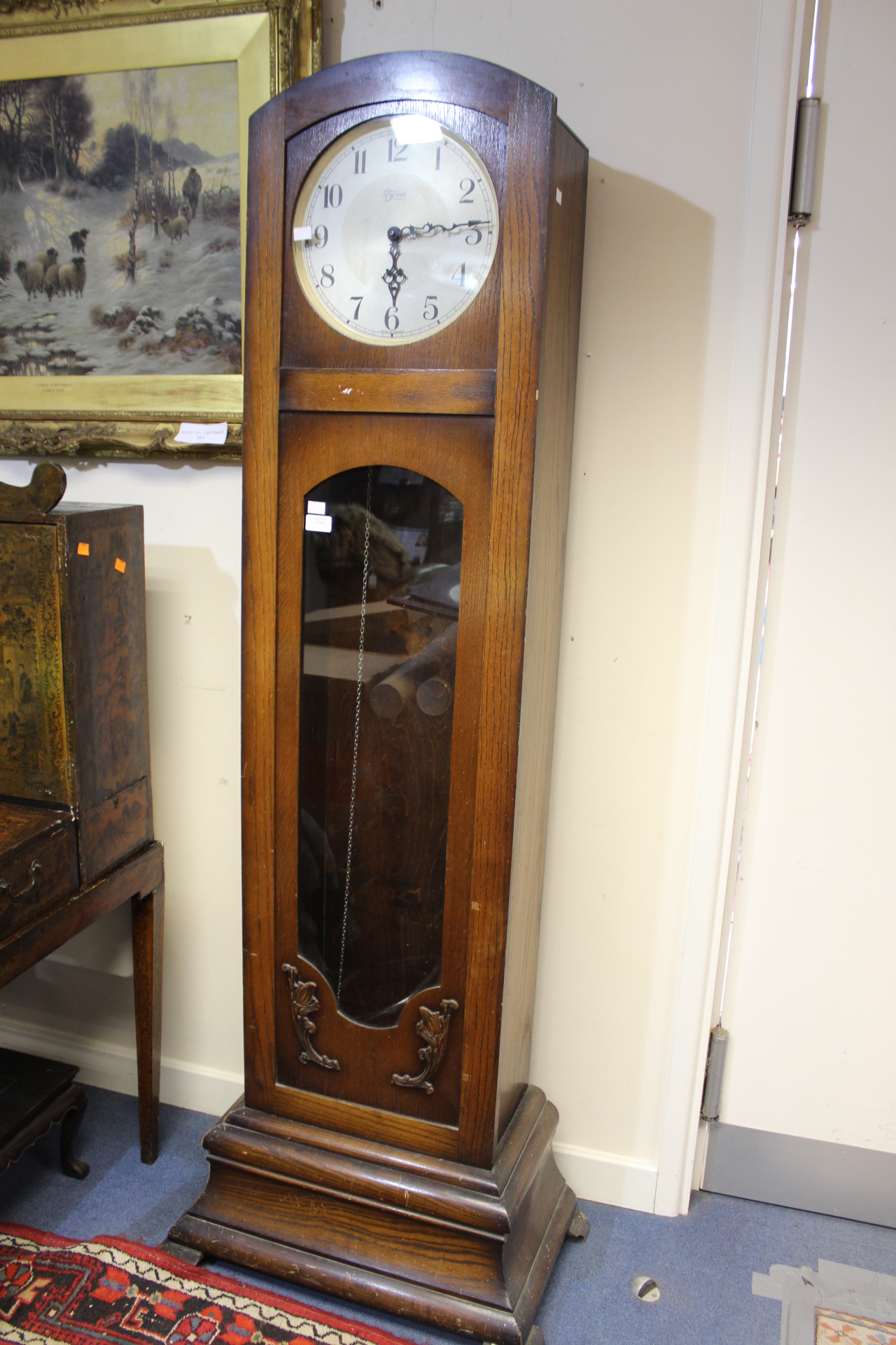 A George V Tymo oak cased longcase clock, circa 1920, having a seven ...