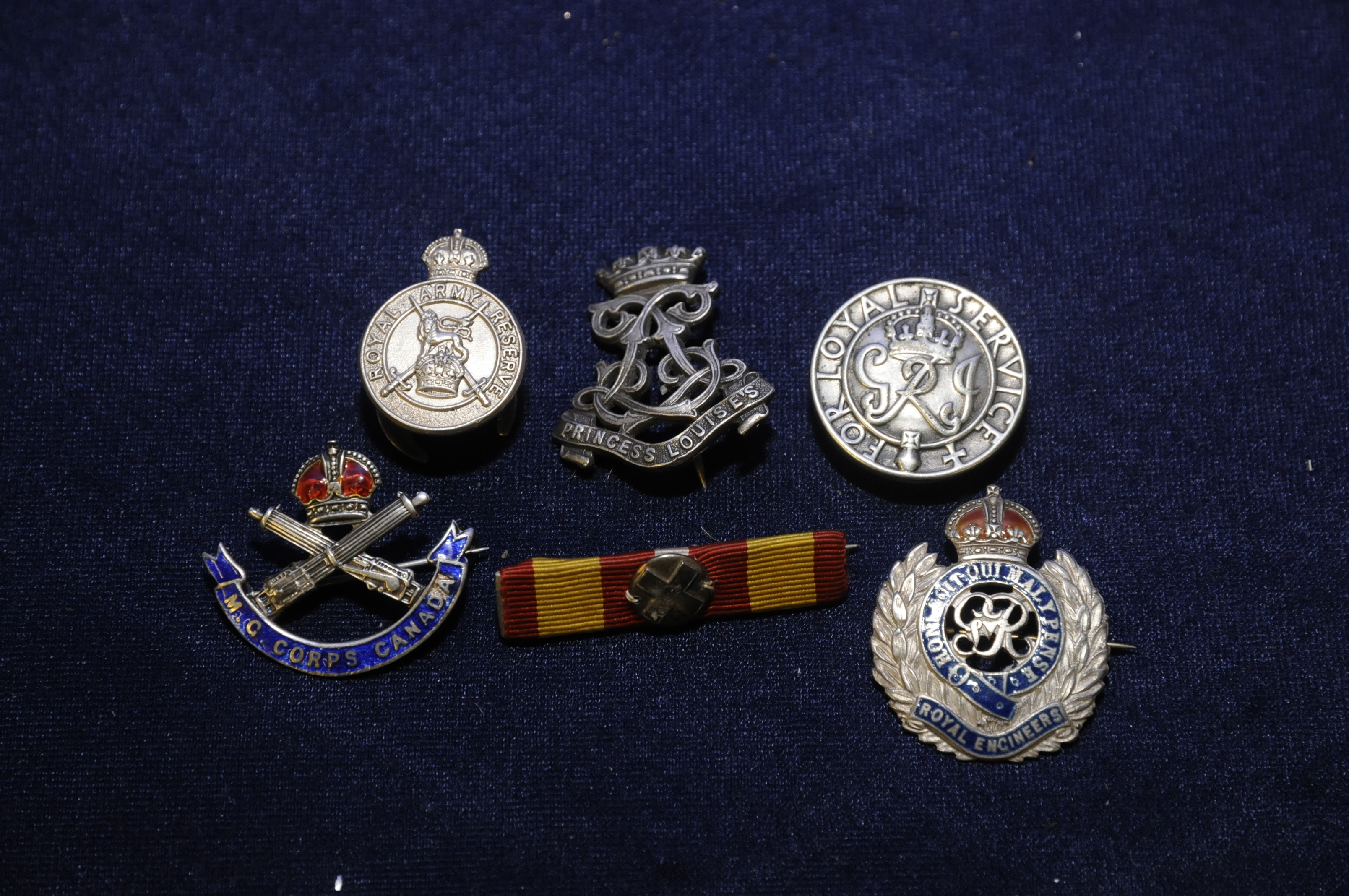 Selection of military lapel badges including Royal Army Reserve, silver ...