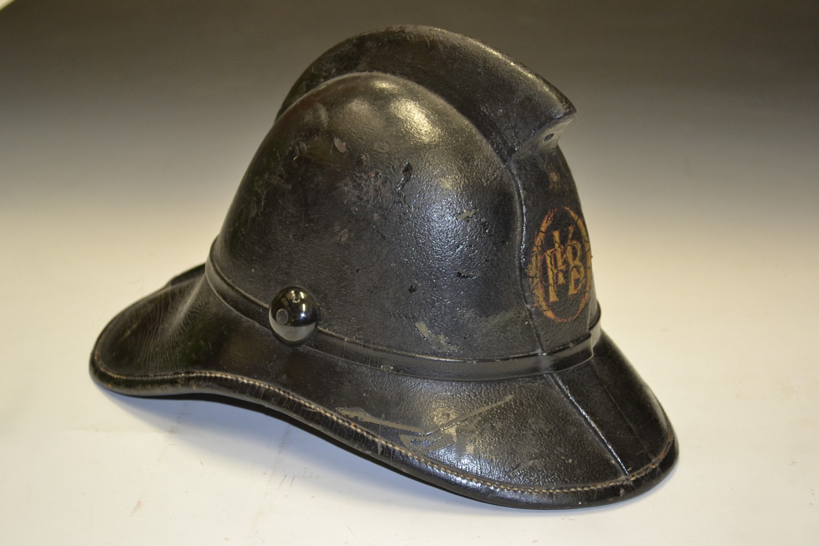 A Scottish leather fire brigade helmet, by James Hendry Ltd., Glasgow ...