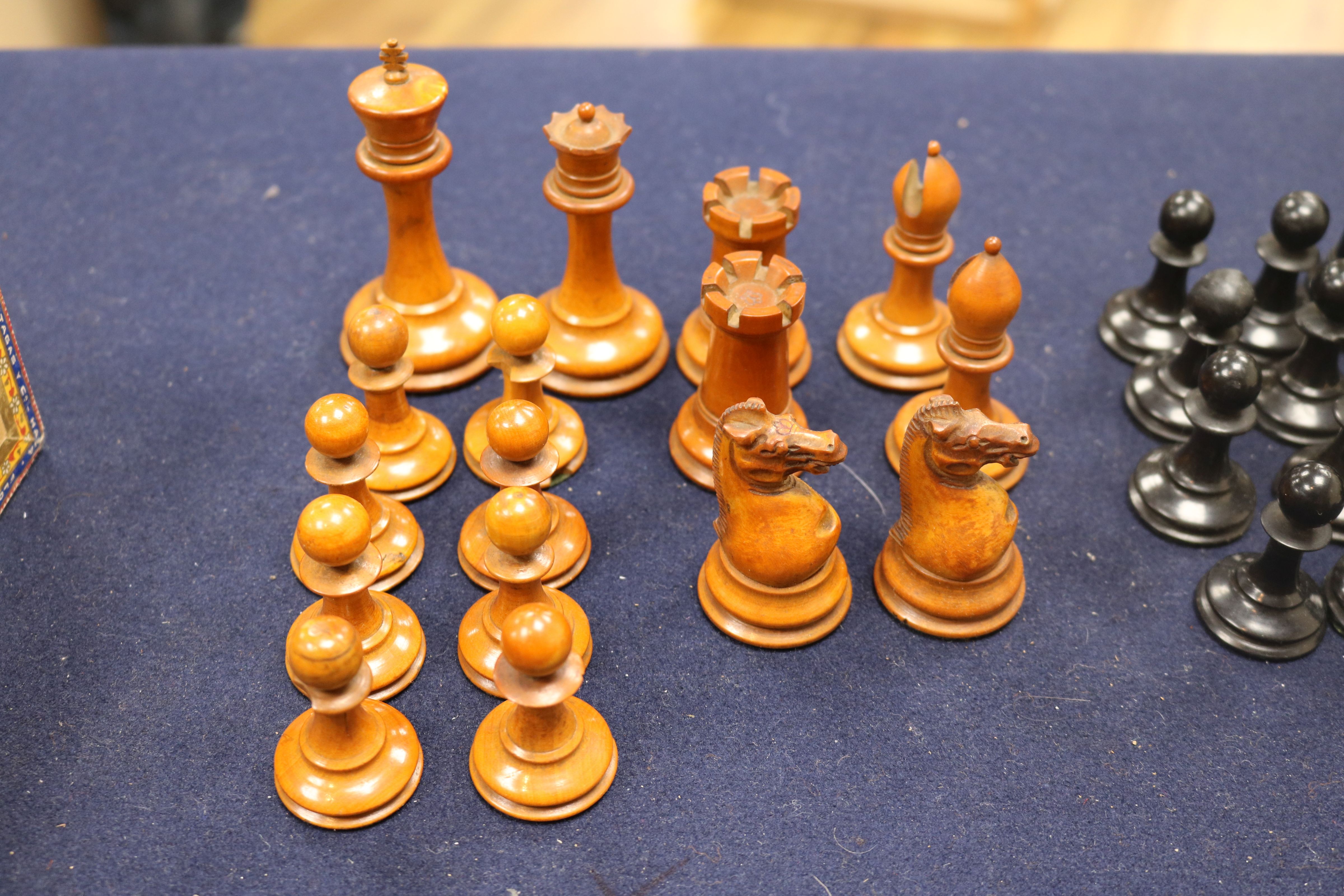 A Jaques Staunton boxwood and ebony chess set, knights and rooks ...