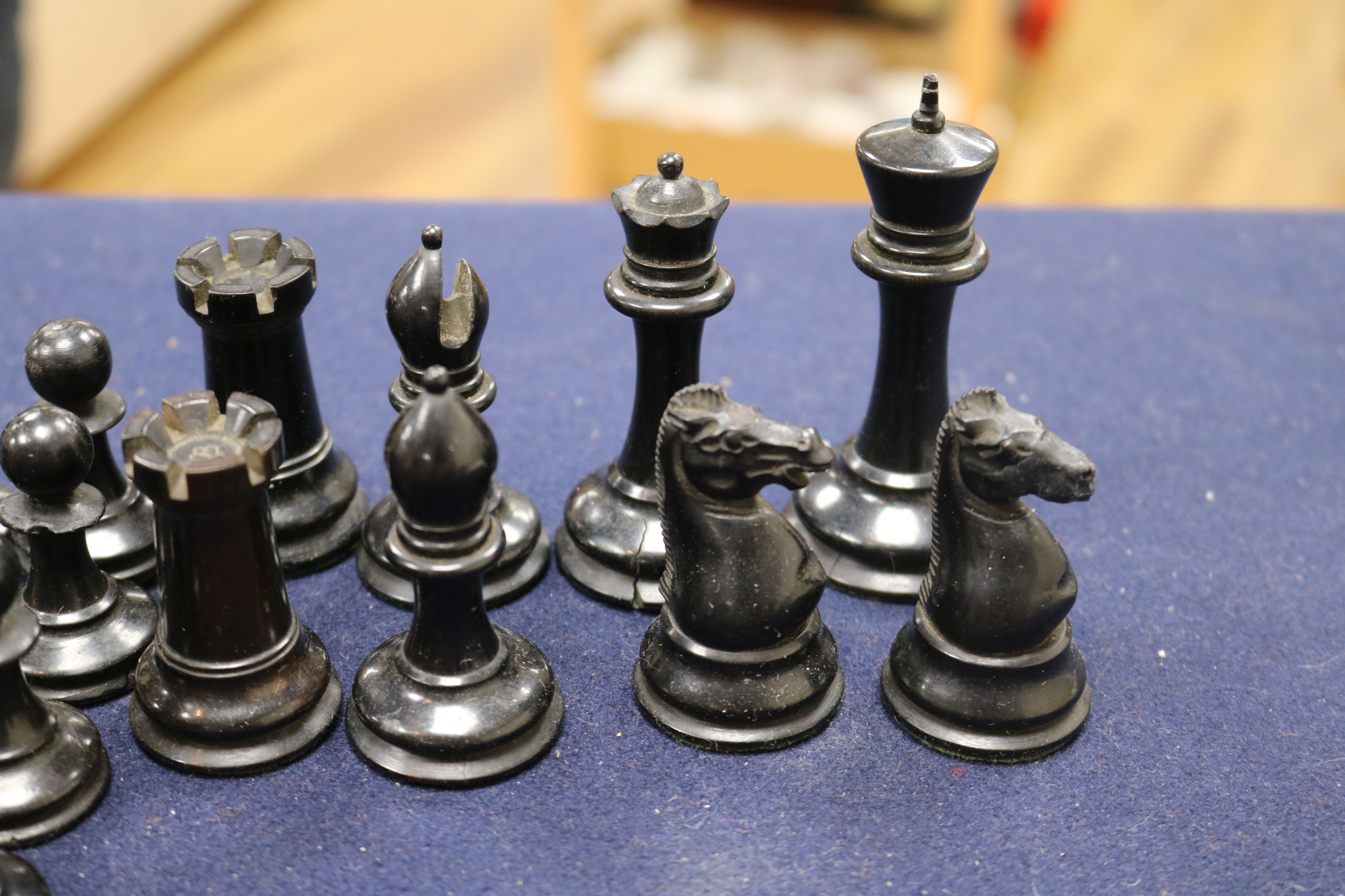 A Jaques Staunton boxwood and ebony chess set, knights and rooks ...