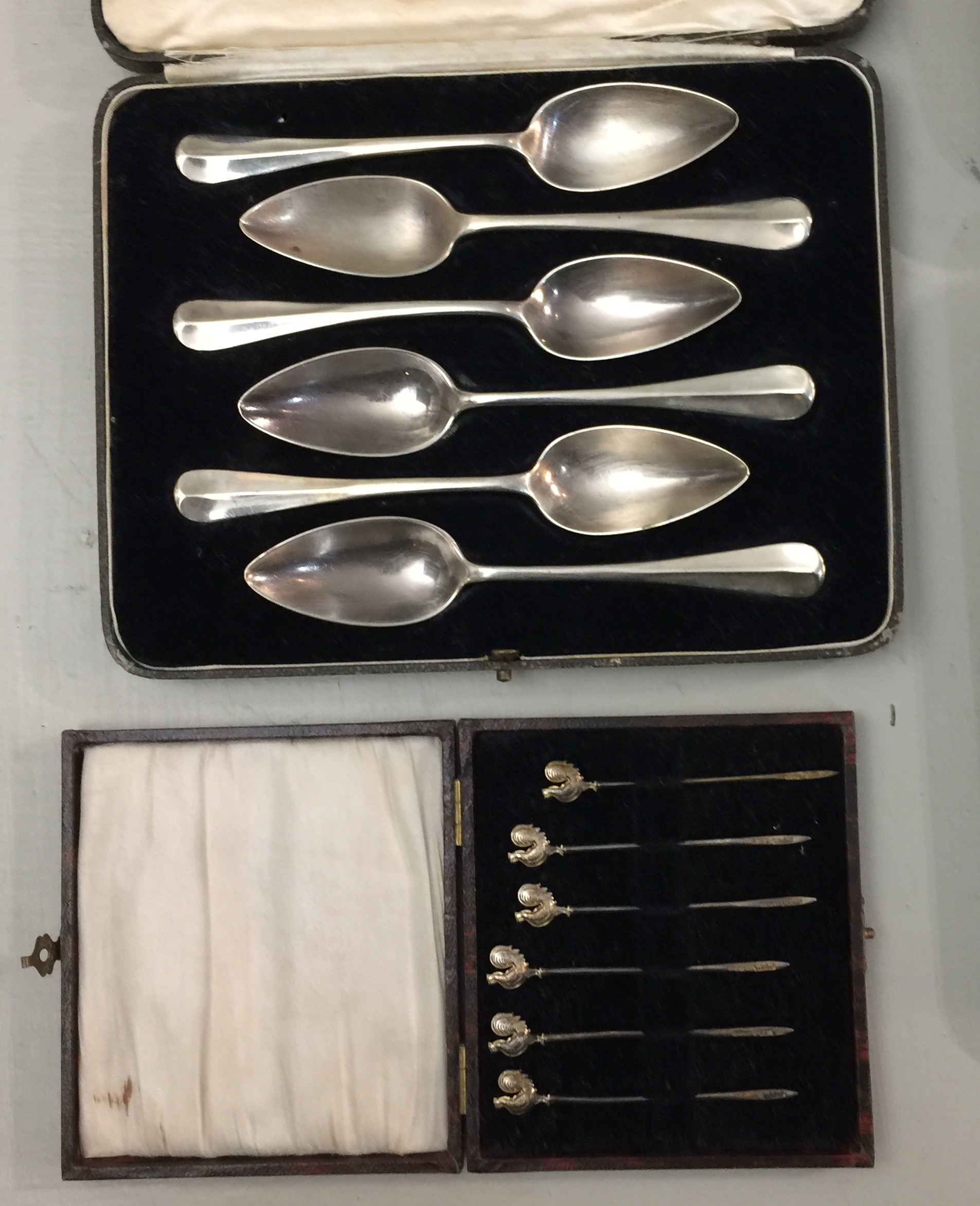 GOLDSMITHS & SILVERSMITHS CO., A CASED SET OF CUTLERY Along with a ...