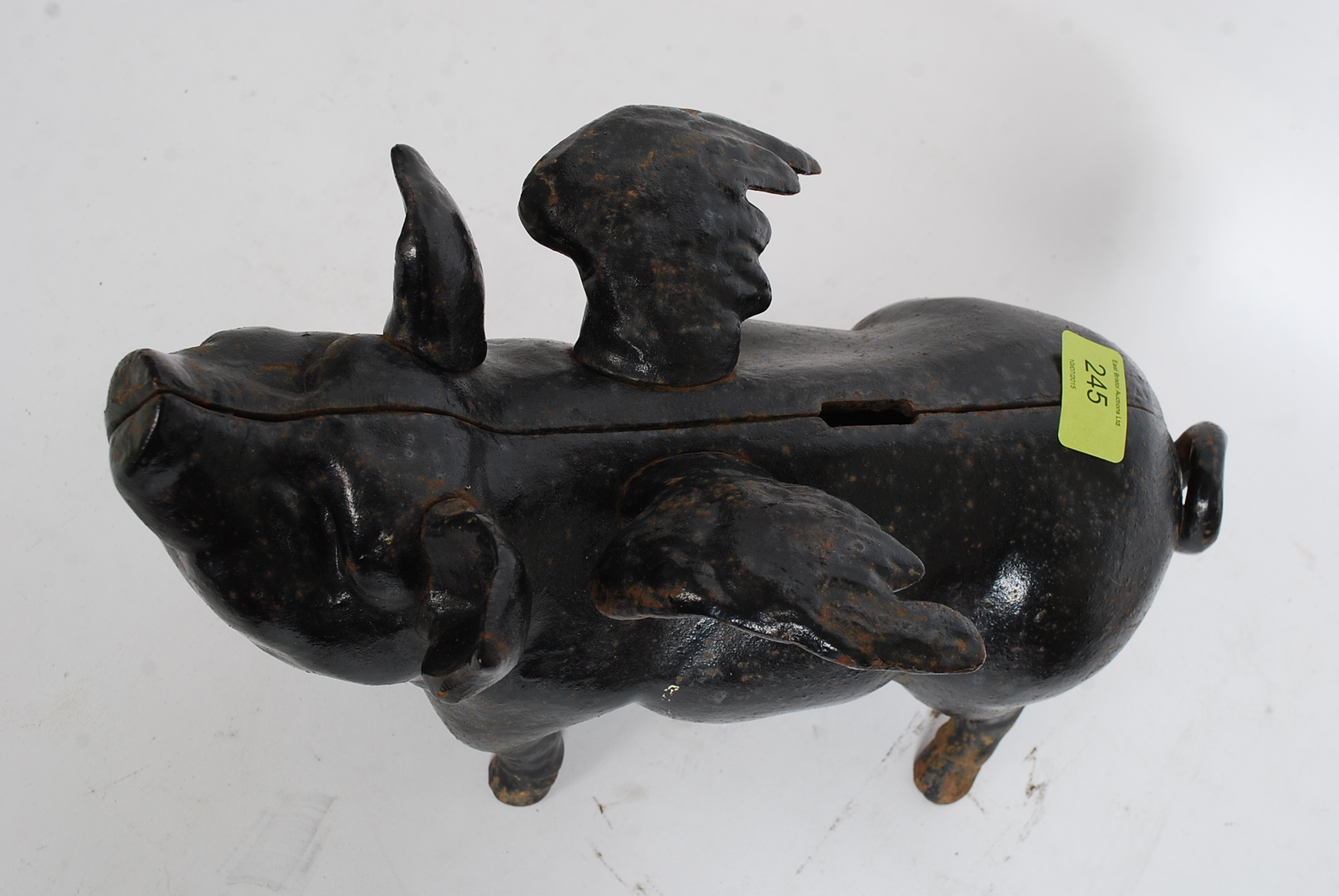 A vintage style cast iron flying pig money box in the form of a smiling ...