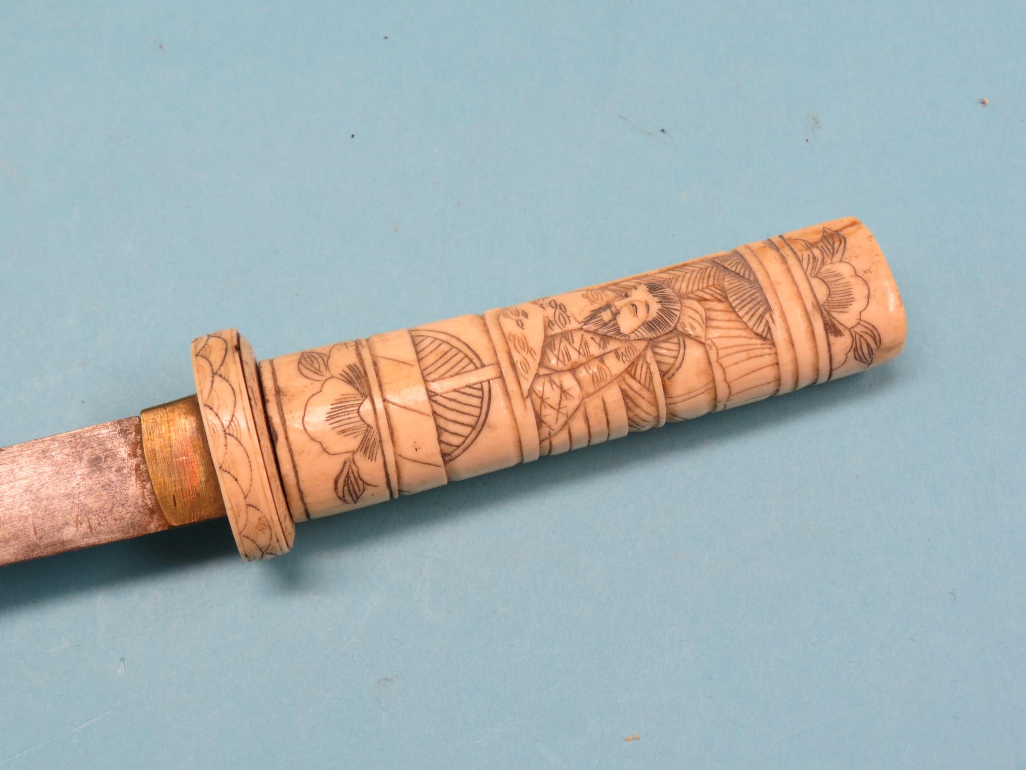 A 19th century Chinese bone dagger, 8in. curved, single-edged blade ...