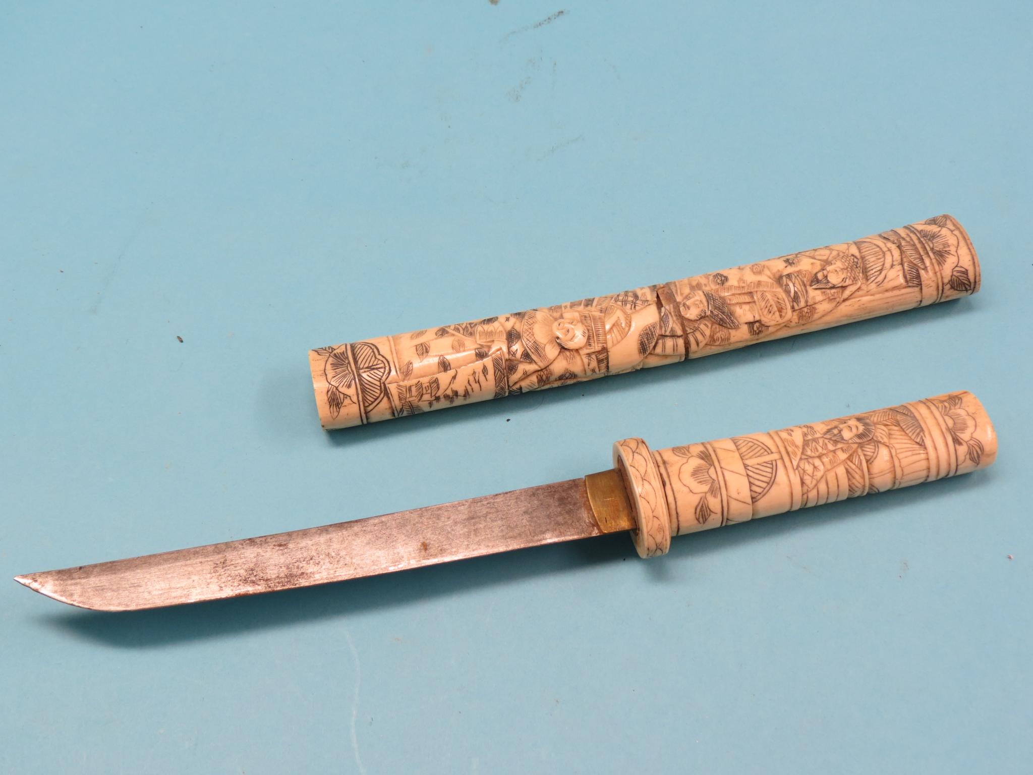 A 19th century Chinese bone dagger, 8in. curved, single-edged blade ...