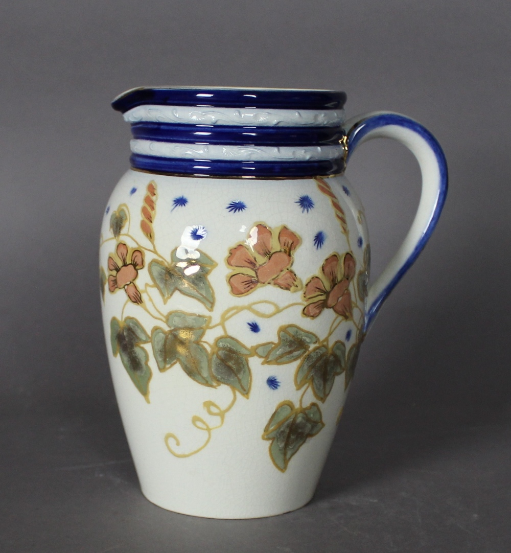 An early 20th Century Macintyre Moorcroft pottery jug, decorated with ...
