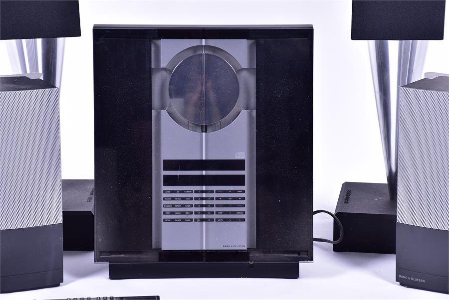 A Bang & Olufsen Beosound 3200 hifi system comprising a central CD ...