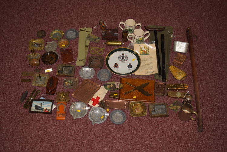 Military items, to include: a pair of prisoners of war decorative ...