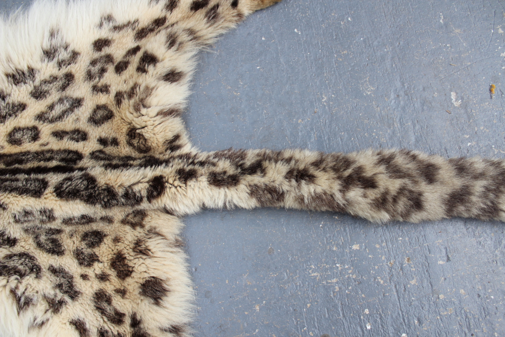 A large antique snow leopard pelt.