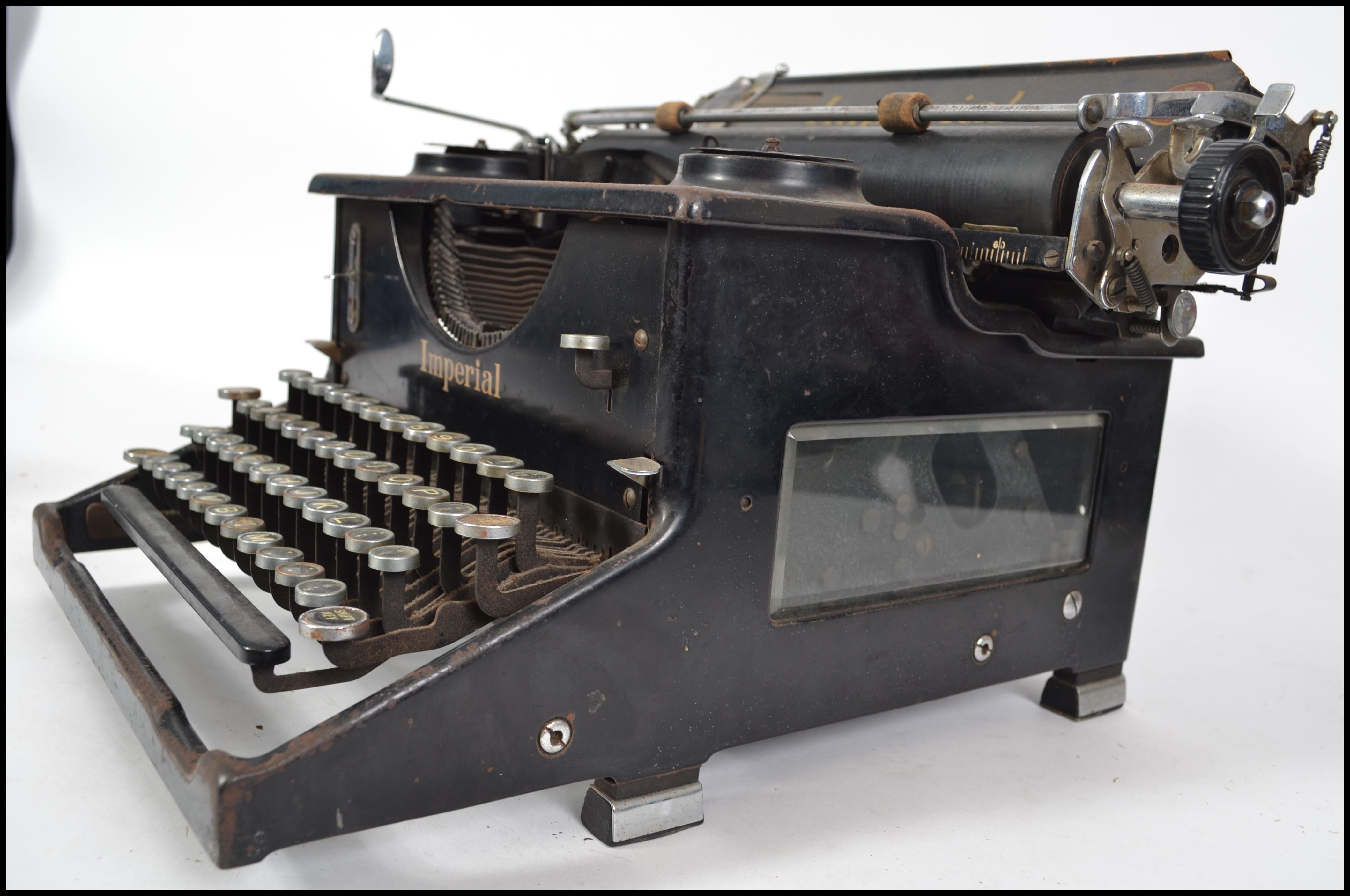 An early 20th century typewriter by Imperial. The enamel painted metal ...
