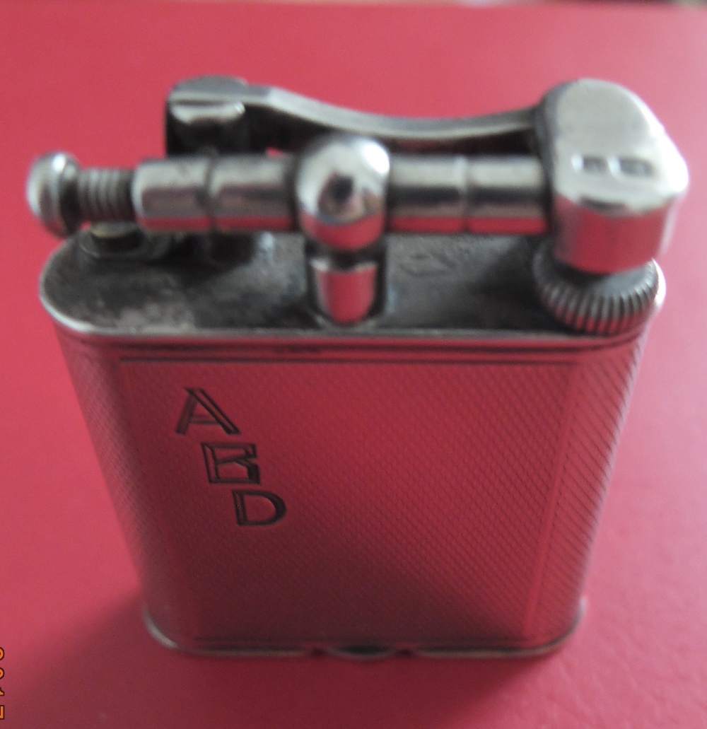 Vintage Silver Dunhill Lighter with London Hallmarks - 52mm x 42mm.The ...