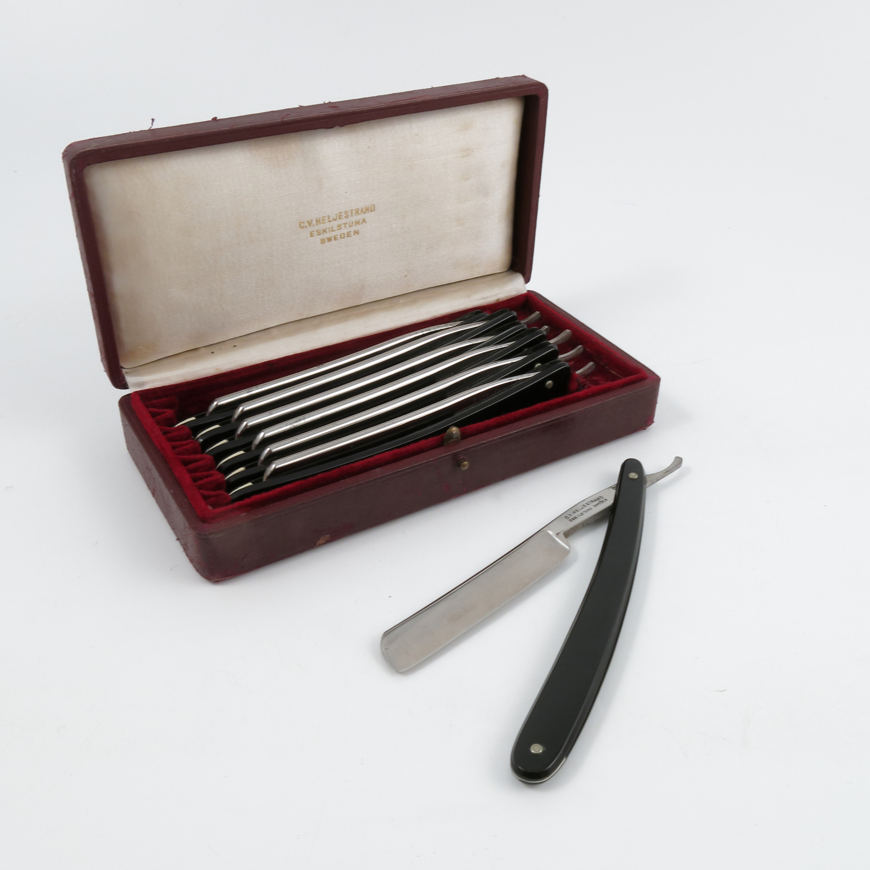 A cased set of seven Swedish cut throat razors, the blades and case ...