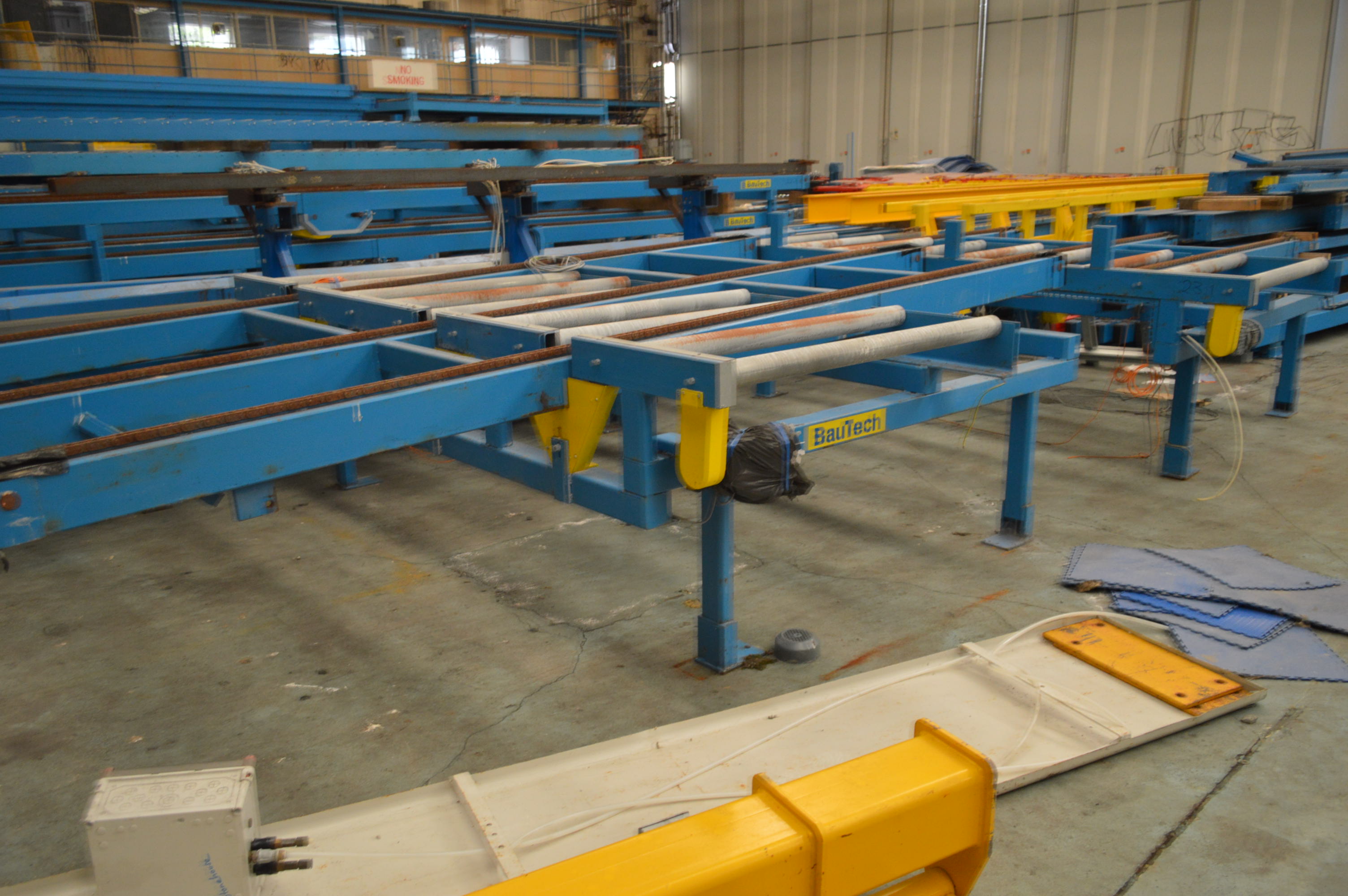 Two BauTech Cross Conveyors, each with powered roller conveyor, 1.33m ...