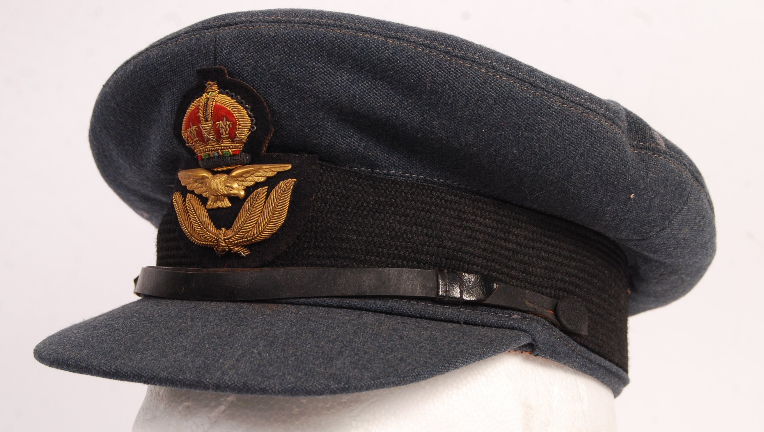A WWII Second World War era 1940's RAF Officer's peaked uniform cap ...