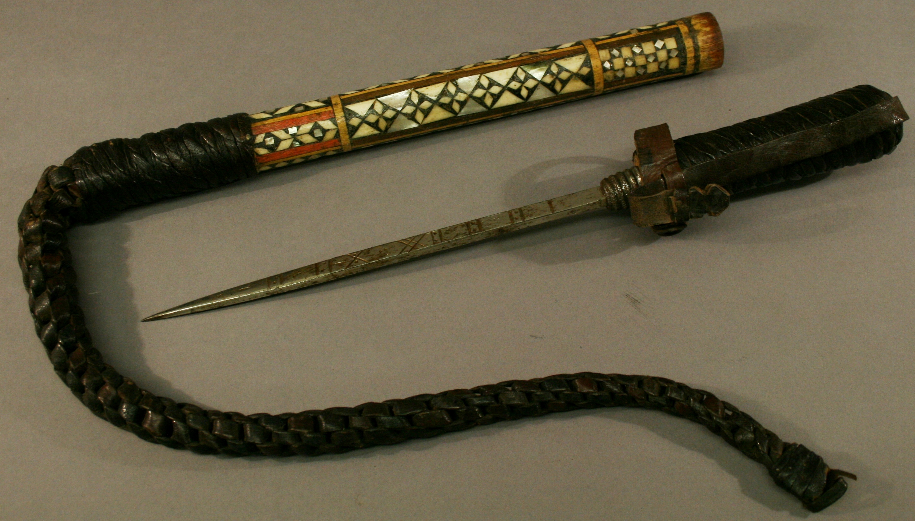 A NORTH AFRICAN CAMEL WHIP early 20th century, the mother-of-pearl and ...