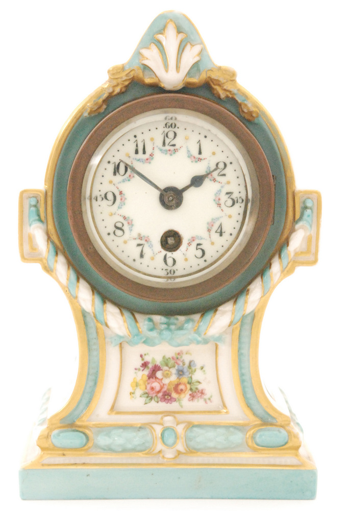 An early 20th Century Royal Worcester mantel clock decorated with a ...
