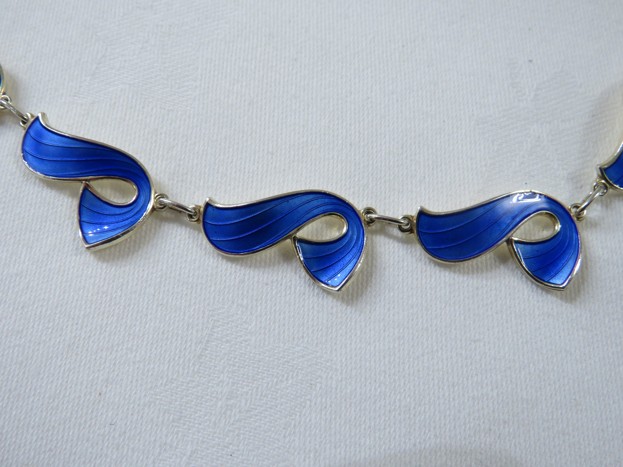 A Norwegian silver and blue enamel necklace of twelve s-shape links ...