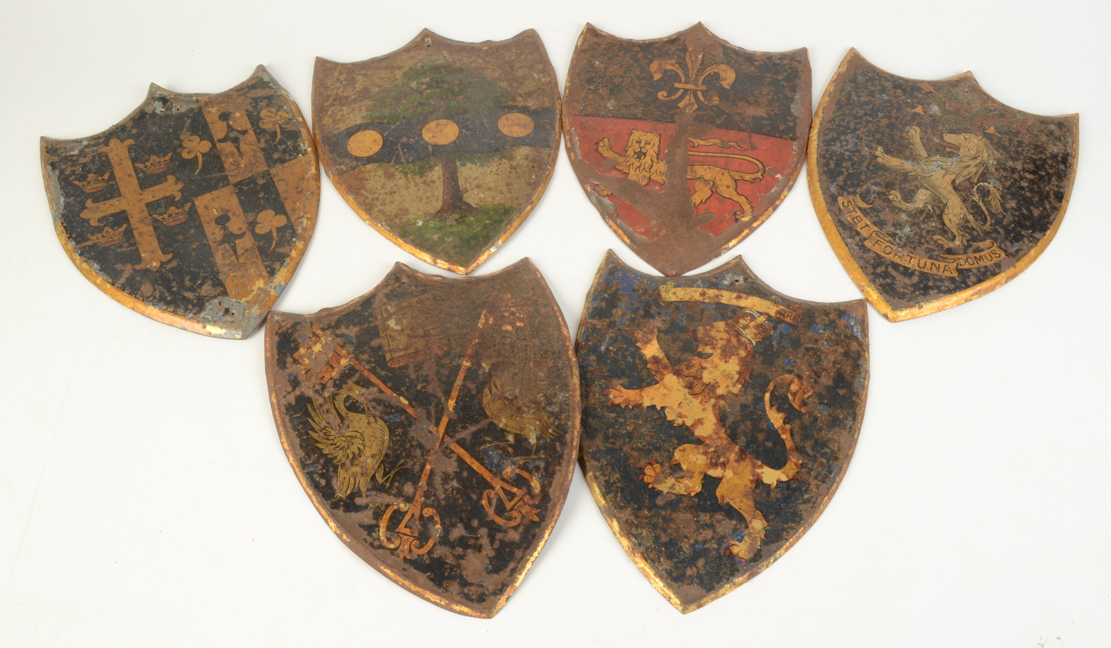 A group of six heraldic, japanned metal shields, height 22.5cm, width 17cm.