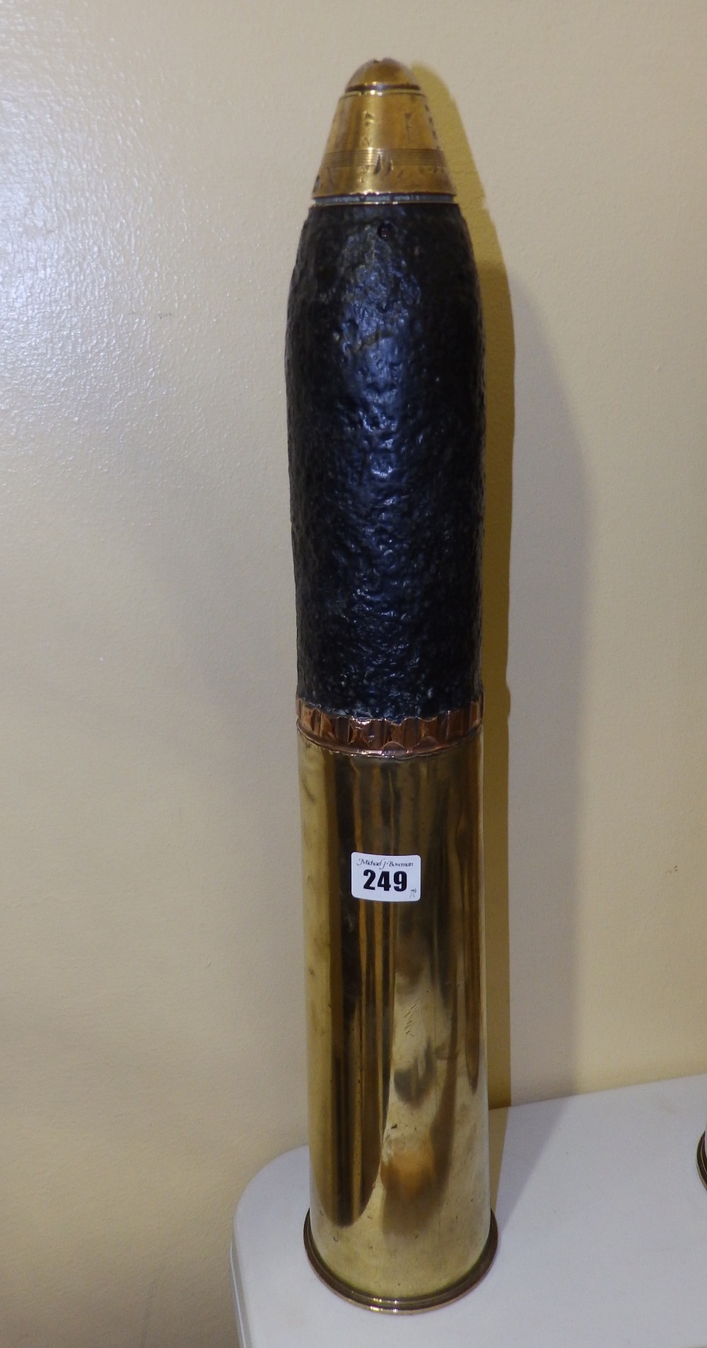 A British WWI 18 pounder high explosive shell and case.