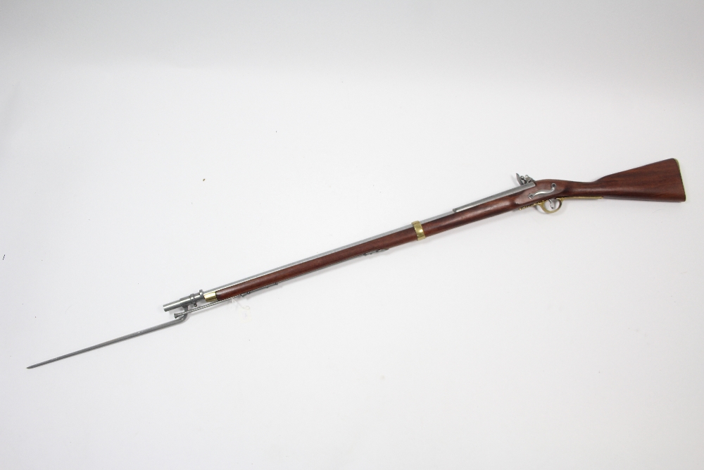 A 17th century-style flintlock musket & rifle bayonet, 58¾” long.