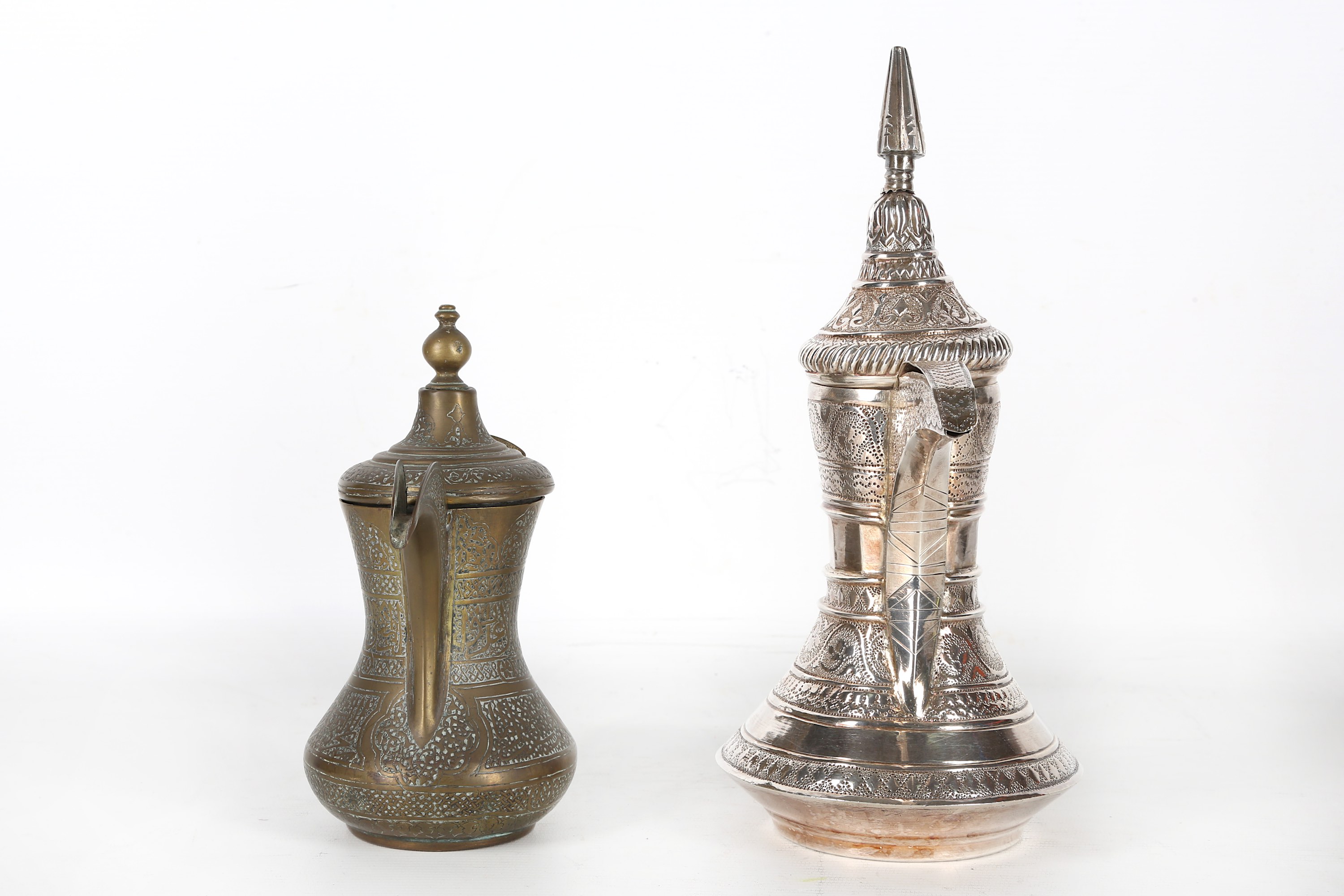 TWO OMANI COFFEE POTS Oman, 19th - 20th century Of typical shape, each ...