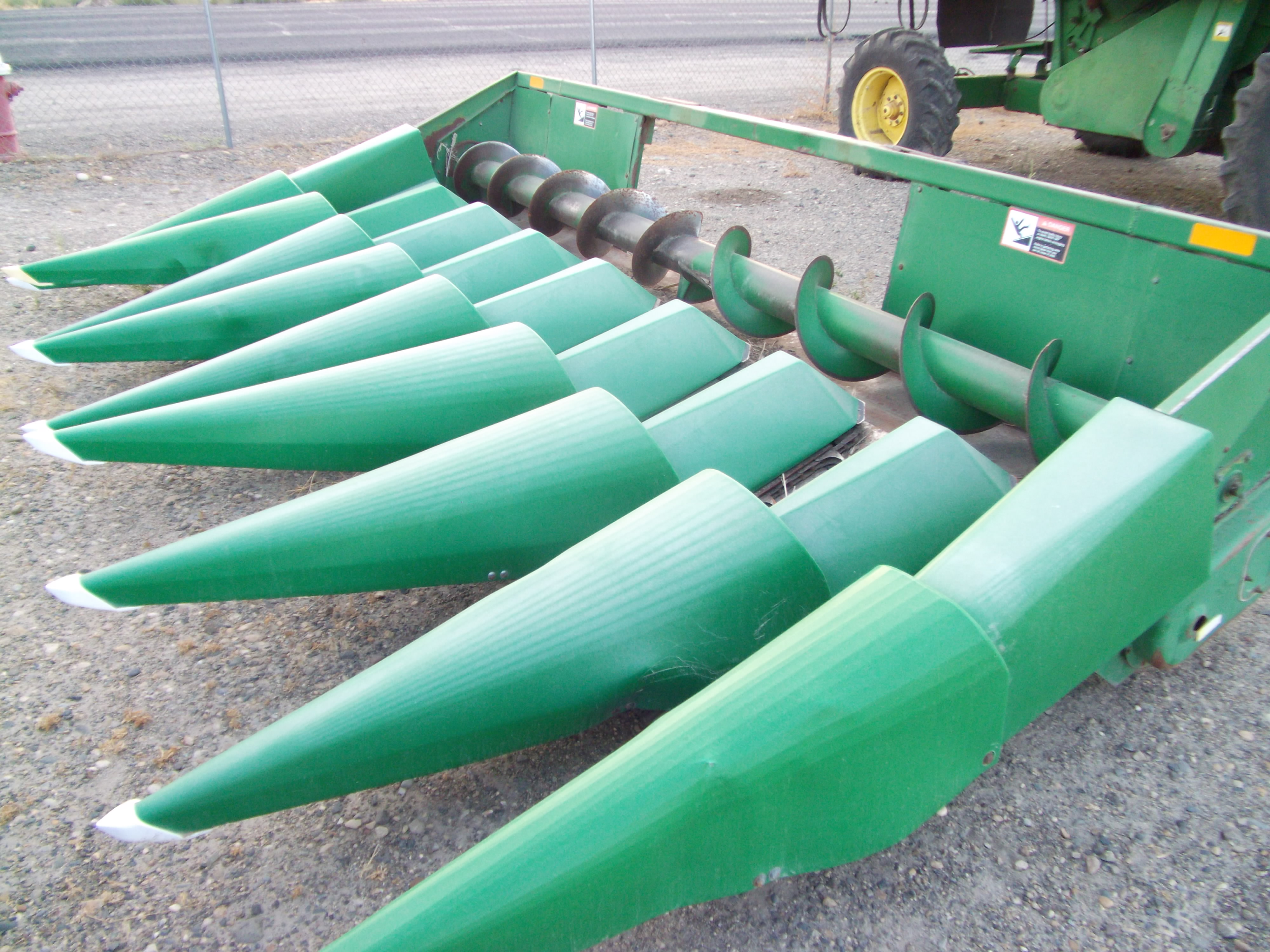 1- JD 8 row 22” corn head w/ poly cones