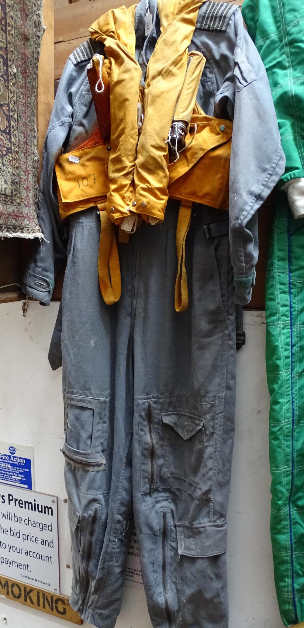 A 1950s RAF light weight flying overalls and life jacket.