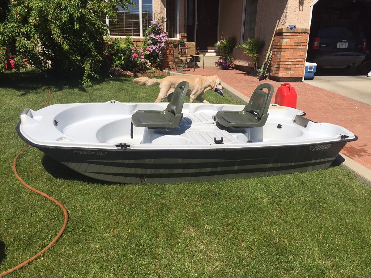 PELICAN PREDATOR DLX Two person boat with battery compartment, live ...