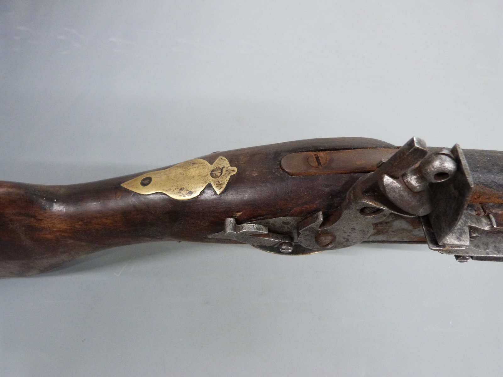 Flintlock hammer action gun with brass trigger guard, butt plate and ...