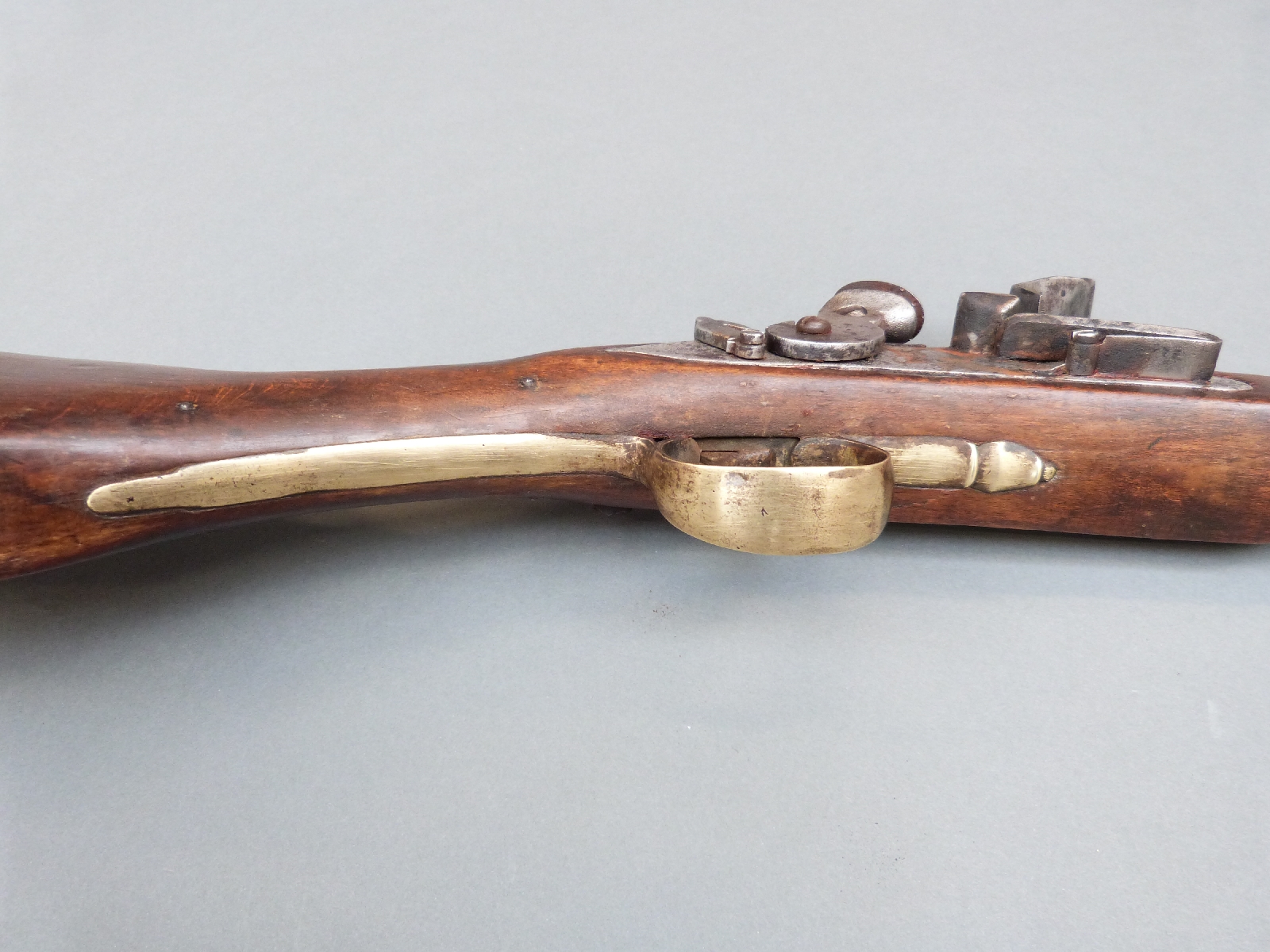 Flintlock hammer action gun with brass trigger guard, butt plate and ...