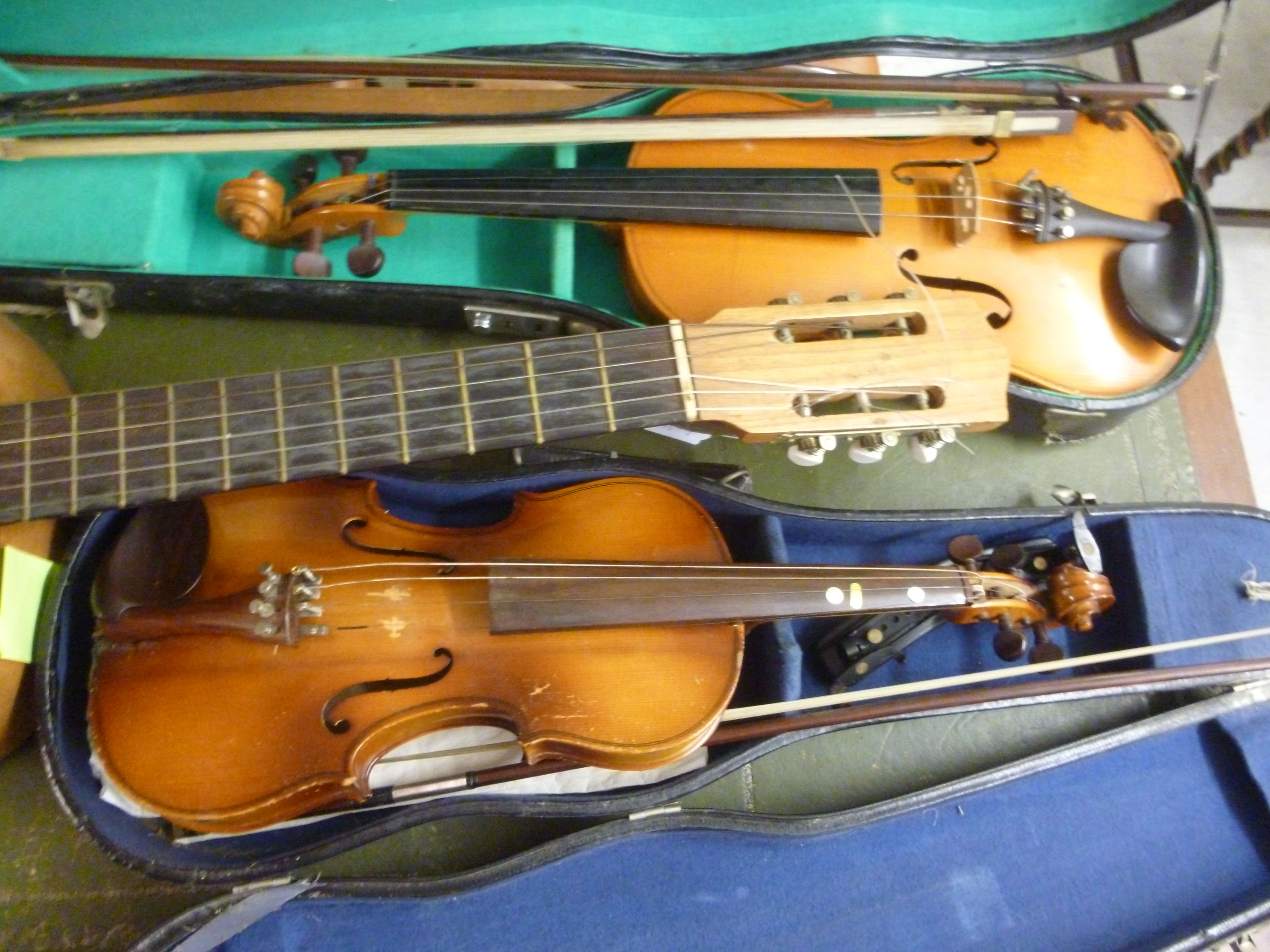 Four stringed musical instruments: to include a 20thC Austrian made ...