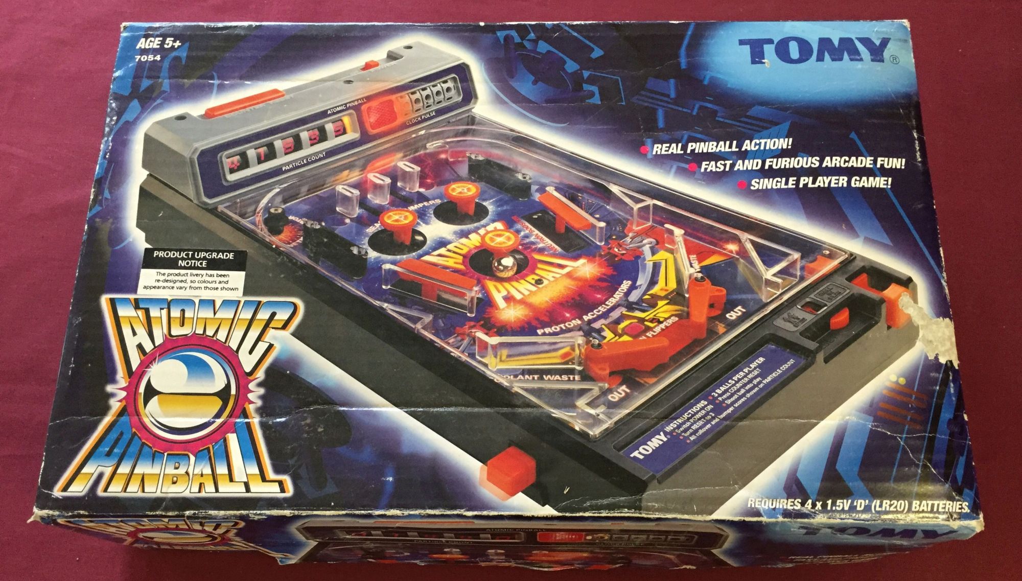 A boxed Tomy Atomic pinball machine.