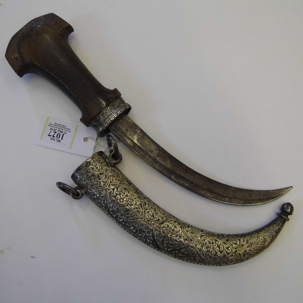 *Jambiya. An Eastern jambiya knife, circa 1900, the 20cm curved steel ...