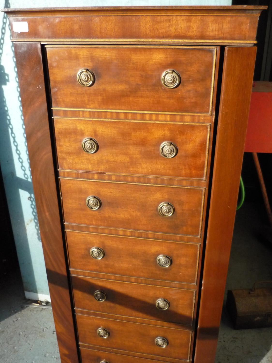 Quality shotgun cabinet in the form of a mahogany Wellington chest, the ...