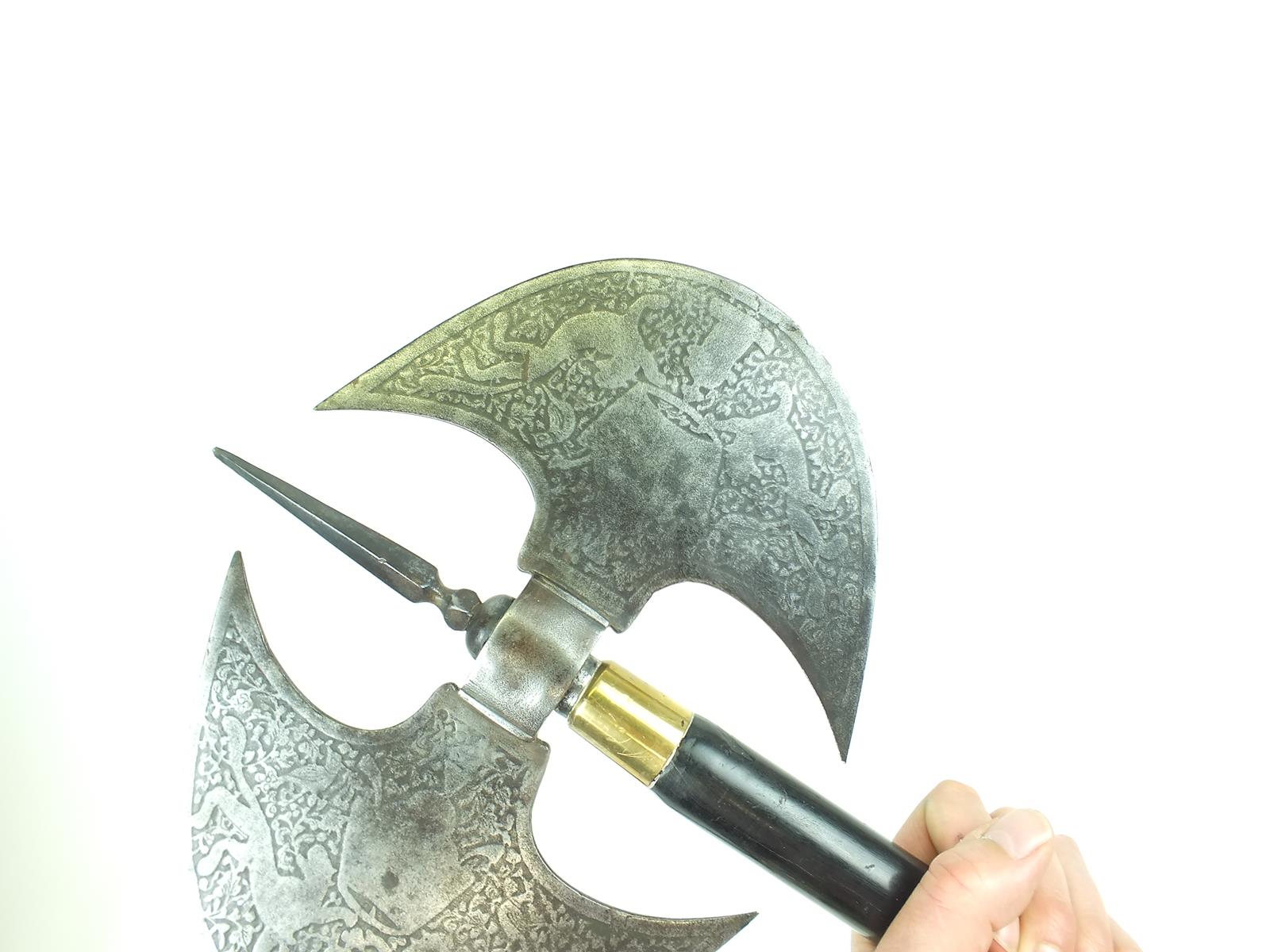 Two Indian axes, the first with double crescent head etched with ...