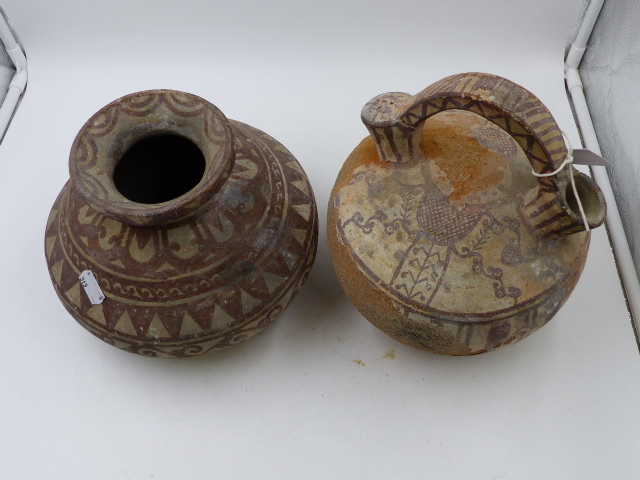 TWO ANCIENT MIDDLE EASTERN POTTERY VESSELS WITH GEOMETRIC DECORATION.