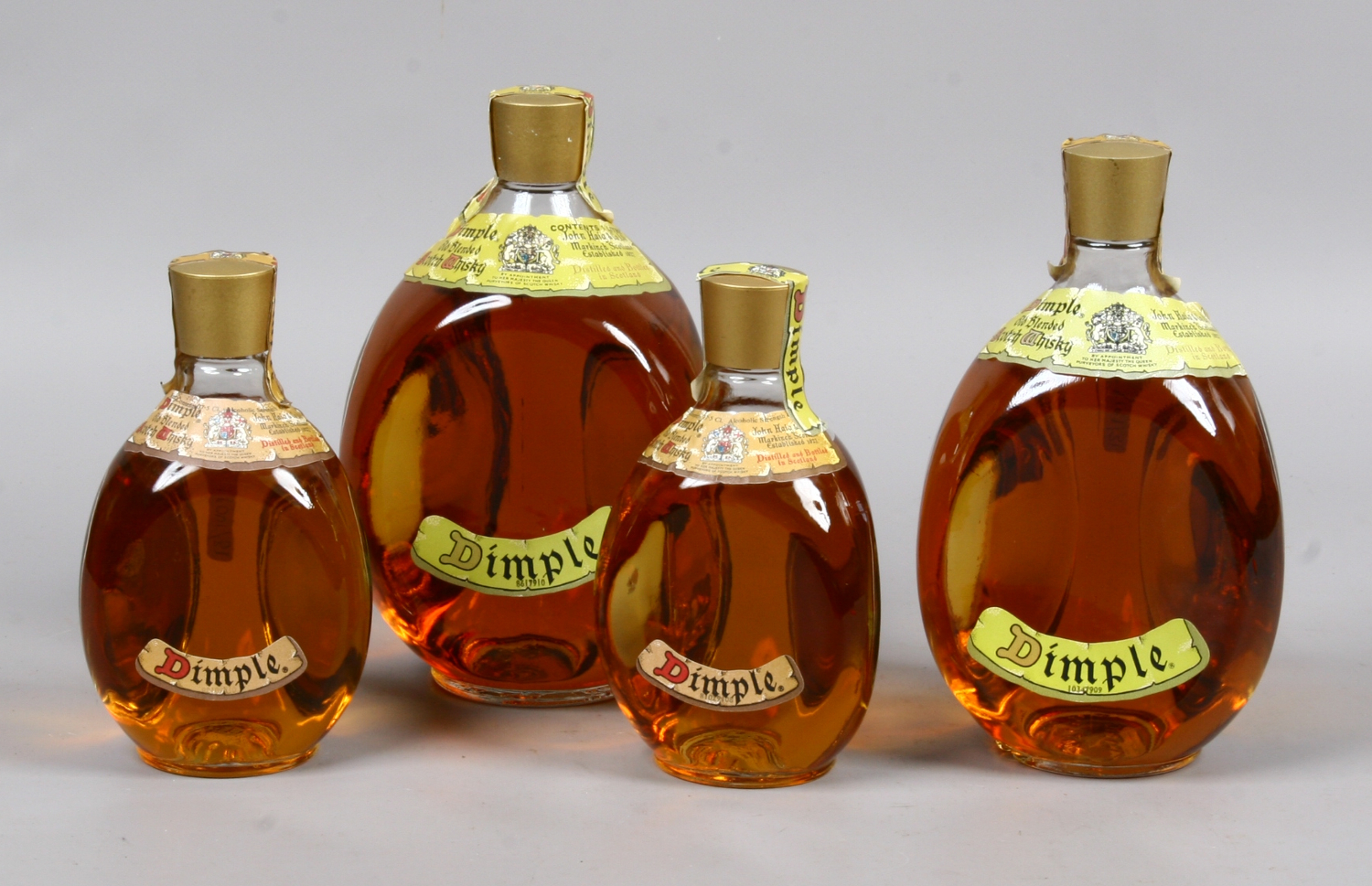 Four unopened and sealed bottles of Dimple whisky by John Hague & Co ...