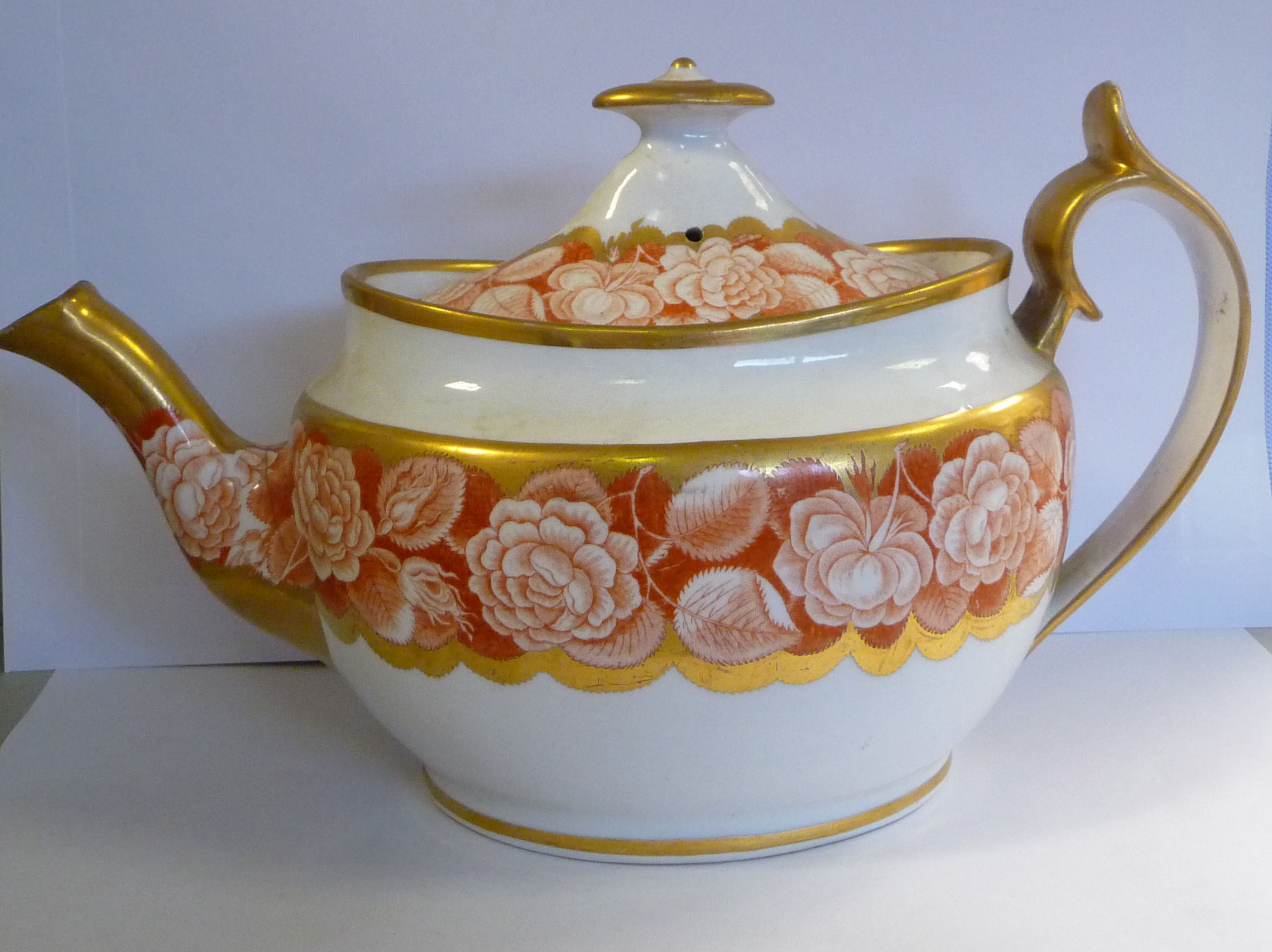 An early 19thC Spode china oval teapot and lid, decorated in sepia and ...