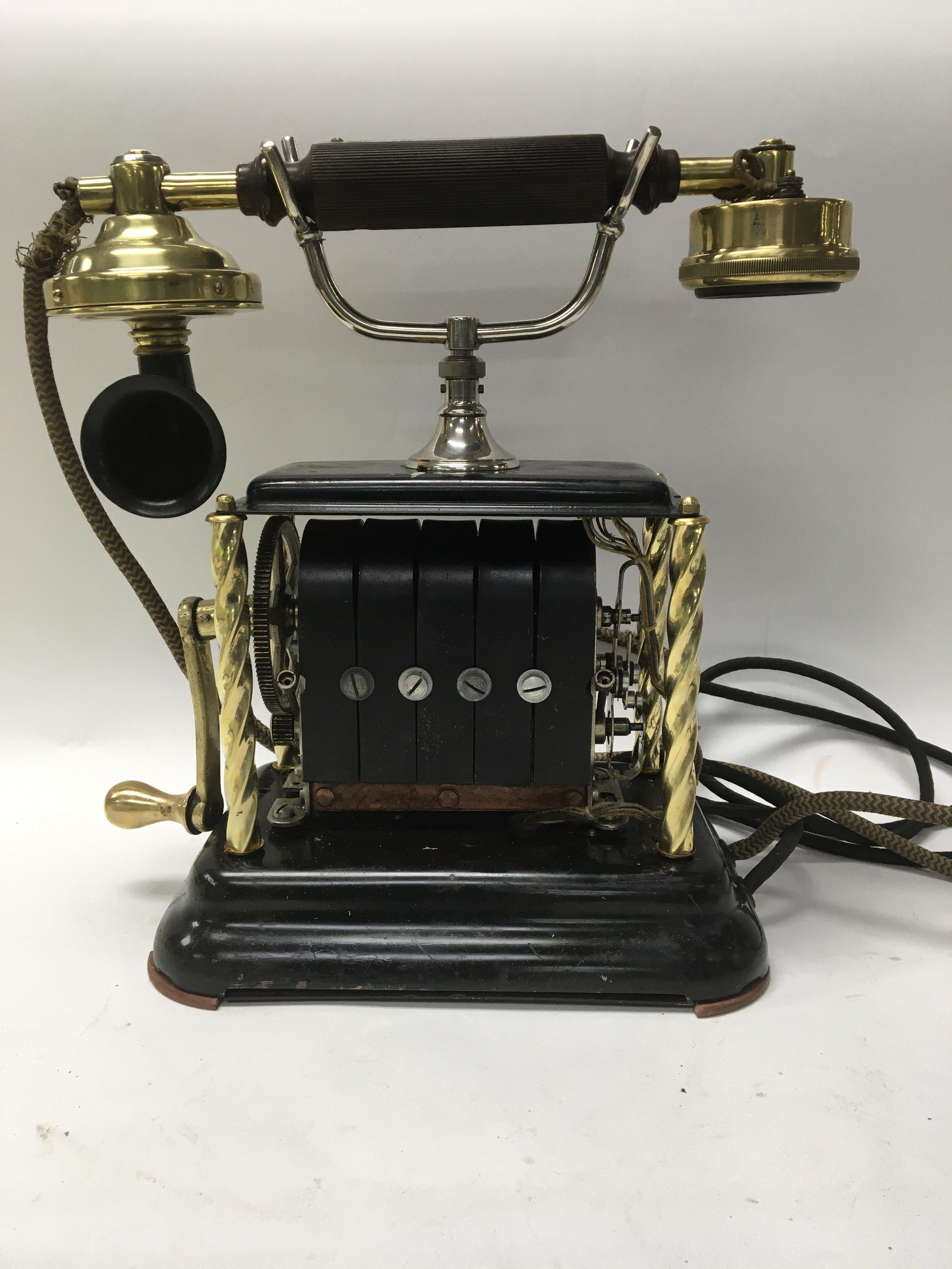 A Edwardian brass skeleton telephone