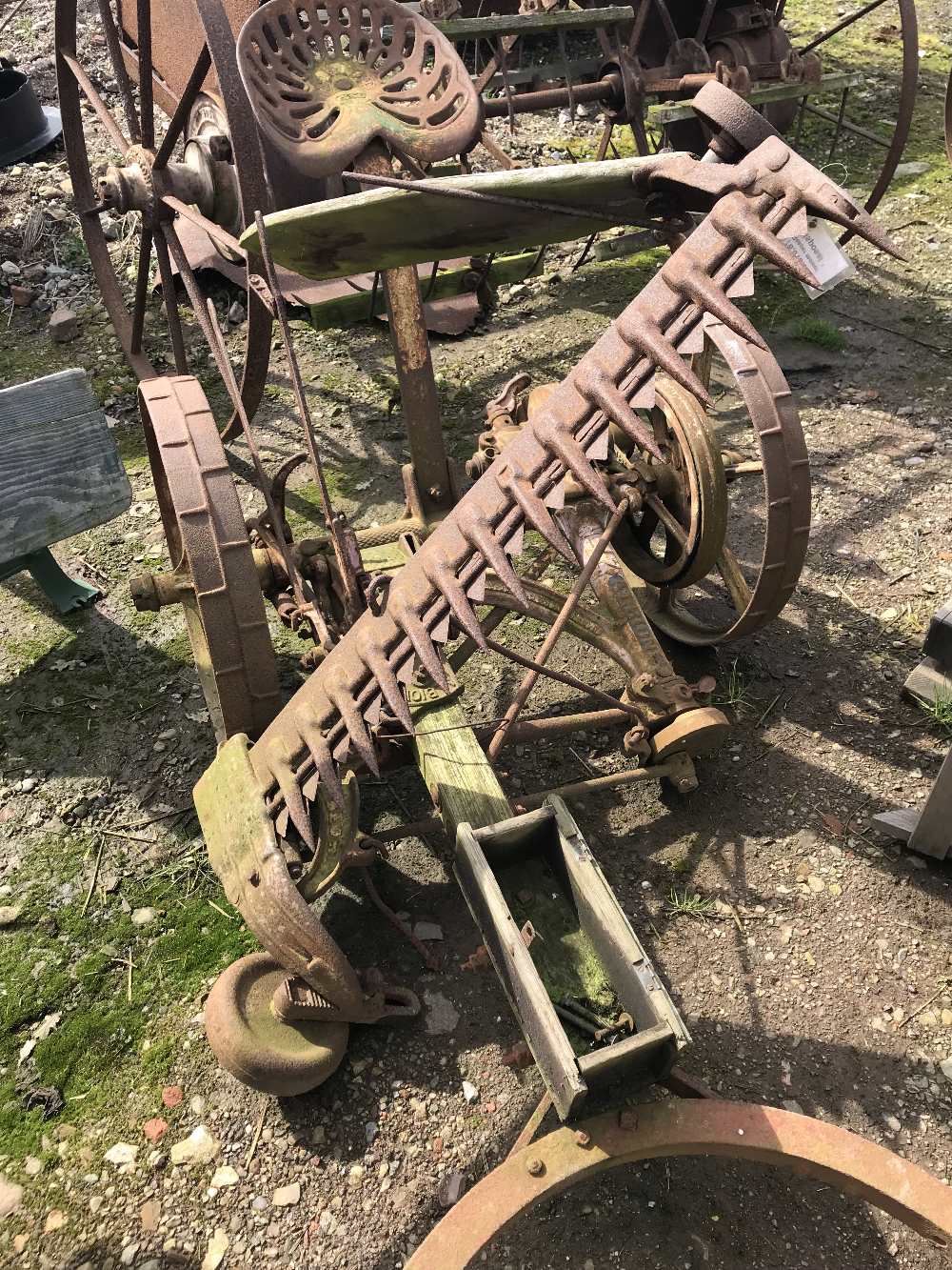 A VINTAGE AGRICULTURAL REAPER MOWER