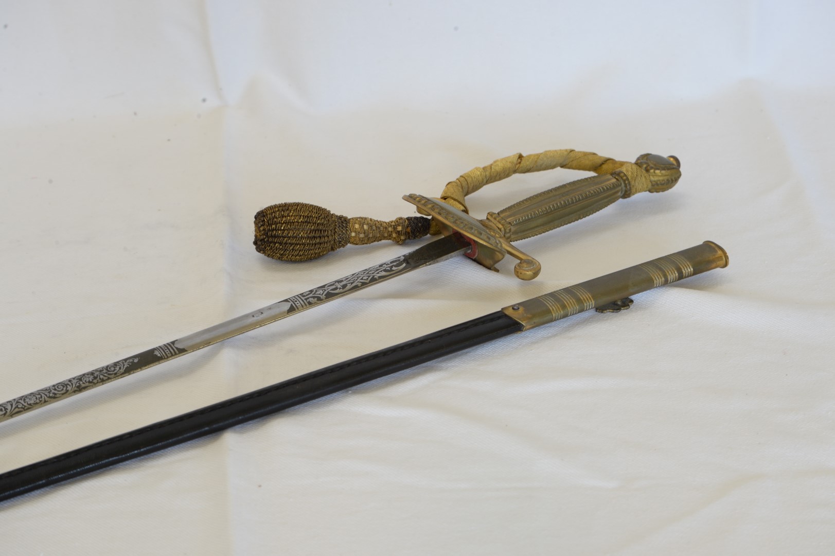 A King George VI ceremonial sword and scabbard. Est £40-60