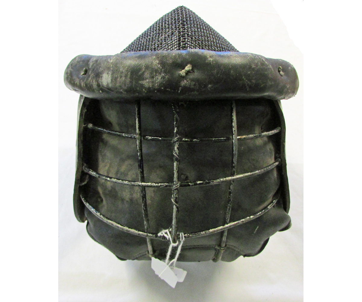 Fencing helmet of metal and leather construction, with a mesh grille ...