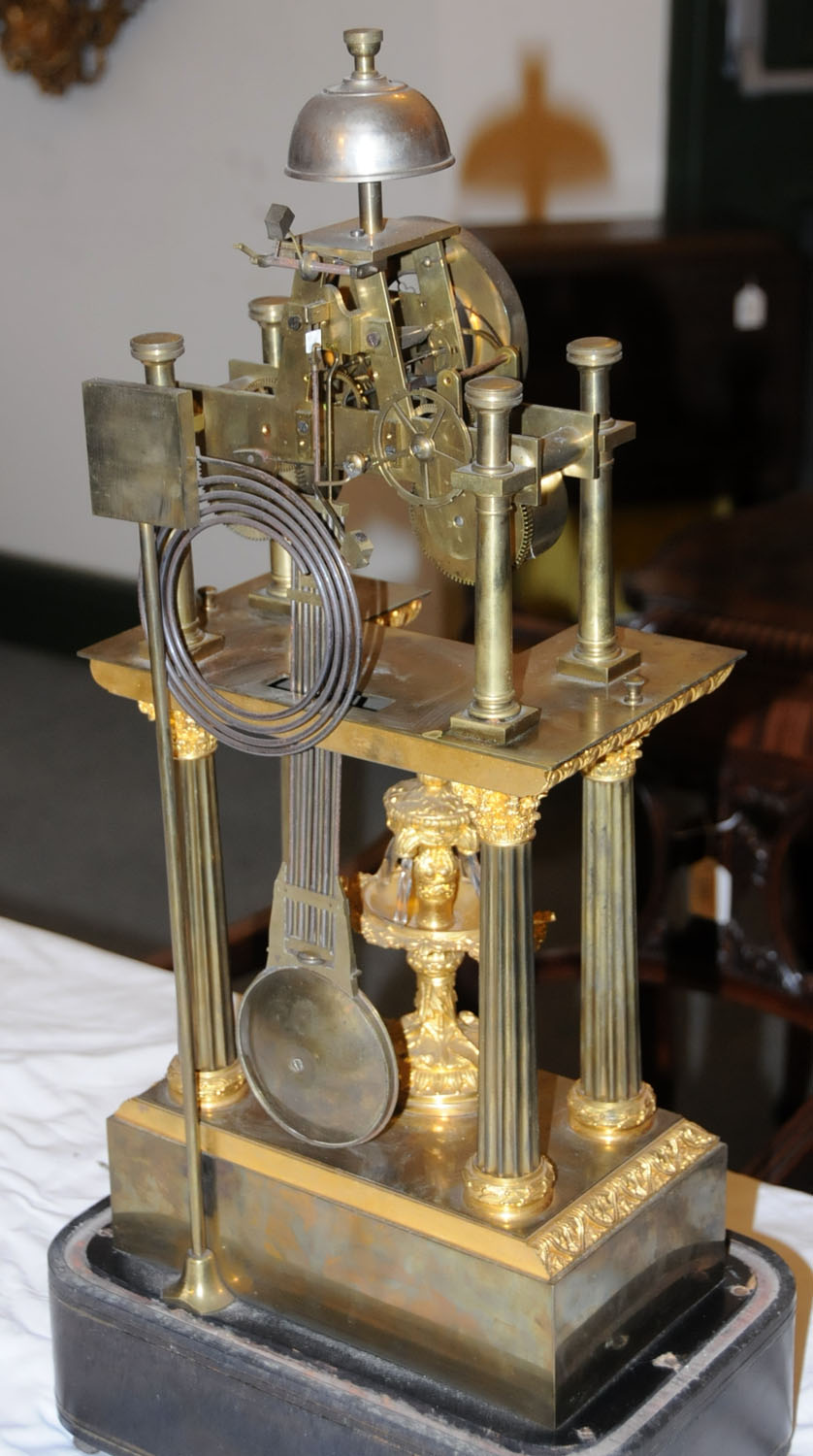 A 19th century automaton table clock, with two-train striking movement ...