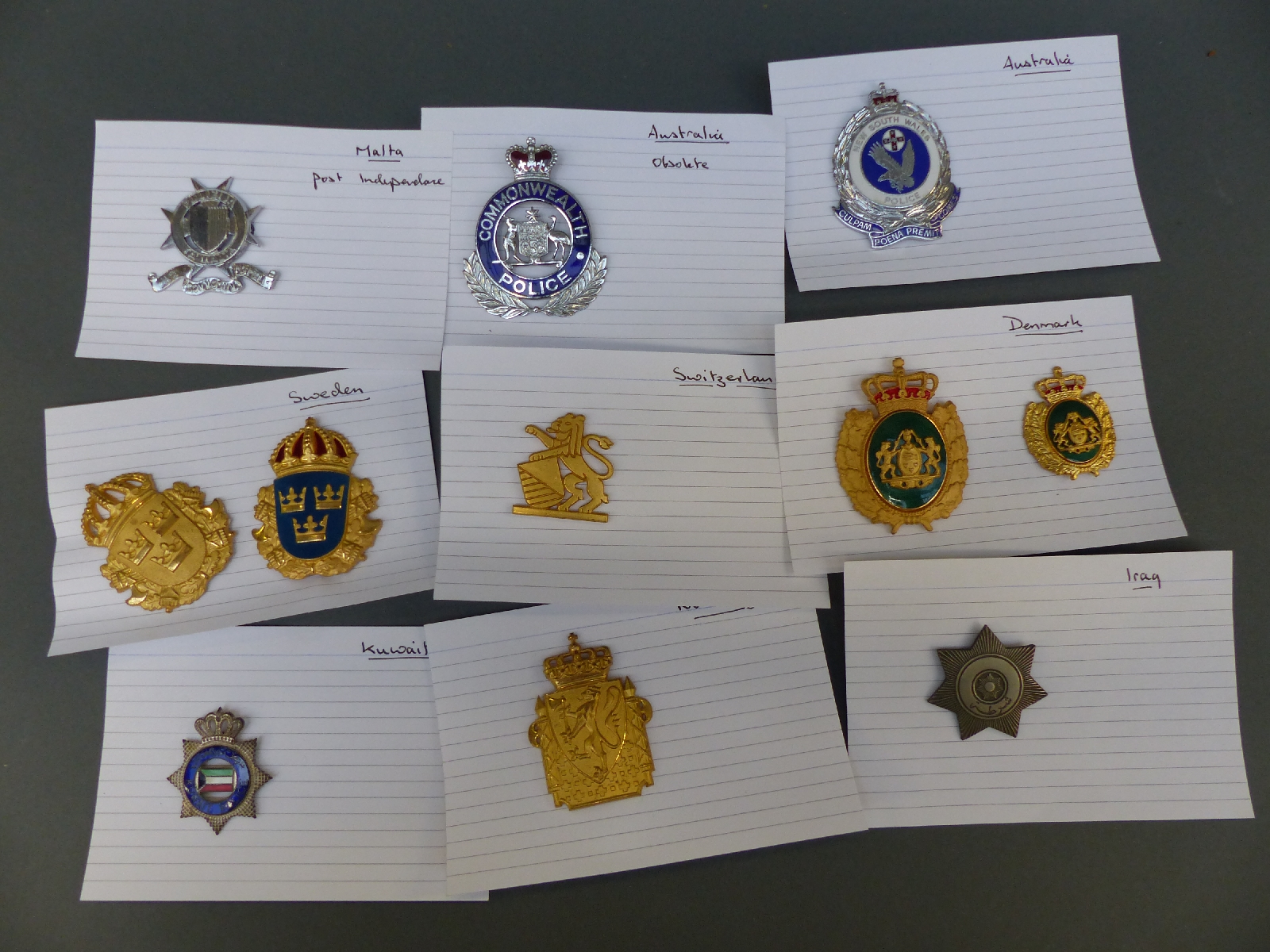 A collection of police badges including Sweden, Iceland, Norway ...