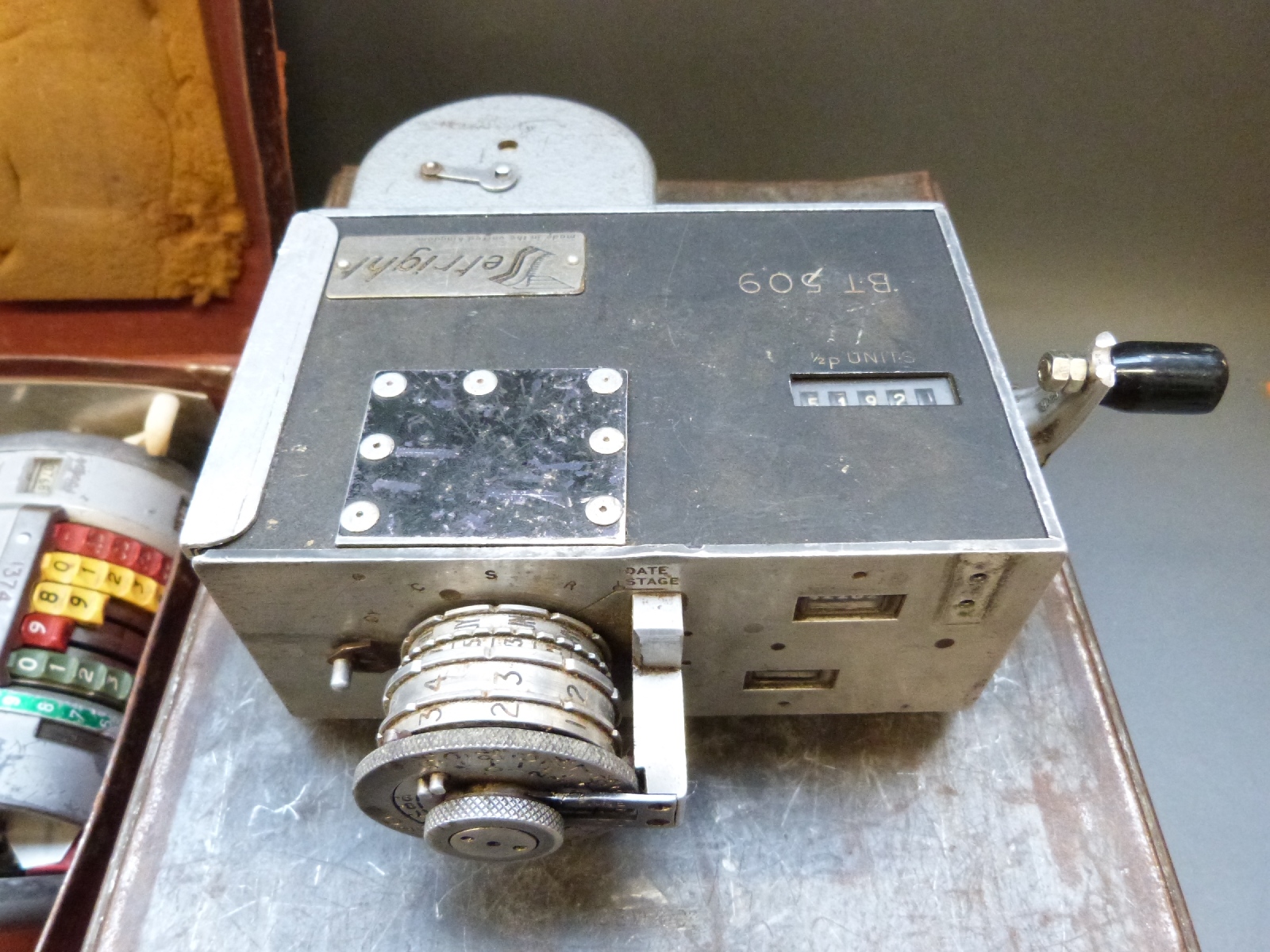 A Setright vintage ticket machine in box and an Almex example in case