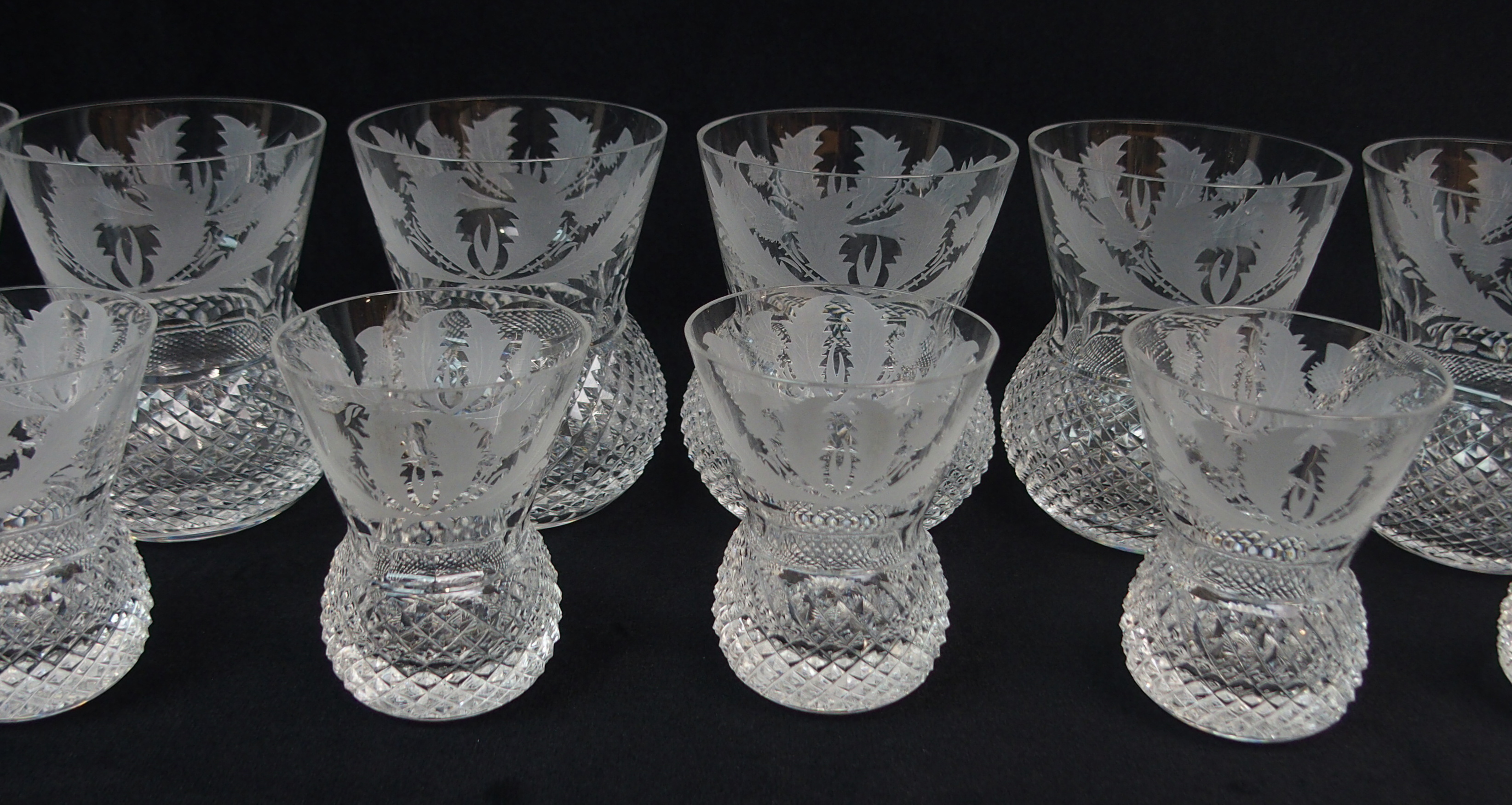 AN EXTENSIVE COLLECTION OF EDINBURGH CRYSTAL THISTLE SHAPED DRINKING ...